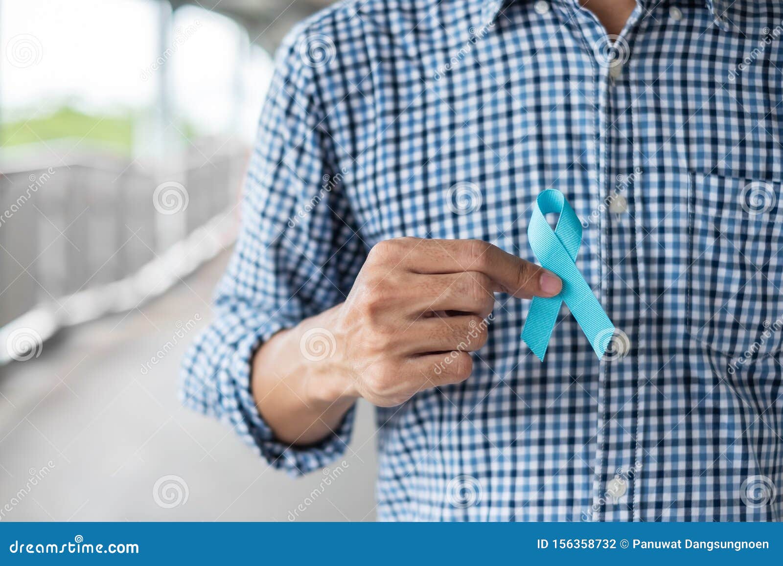 November Prostate Cancer Awareness Month Man In Blue Shirt With Hand