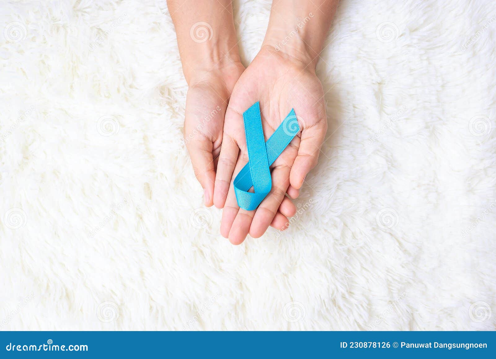 November Prostate Cancer Awareness Month Man Holding Light Blue Ribbon