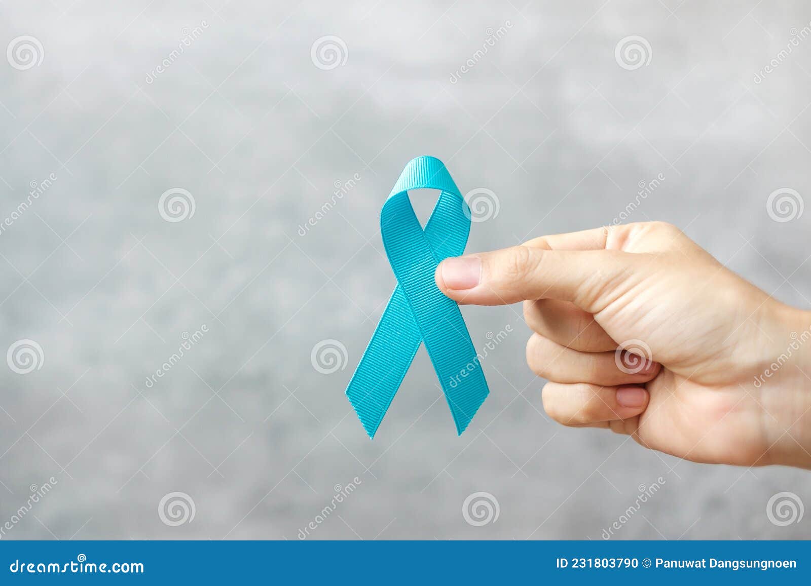 November Prostate Cancer Awareness Month Man Holding Light Blue Ribbon