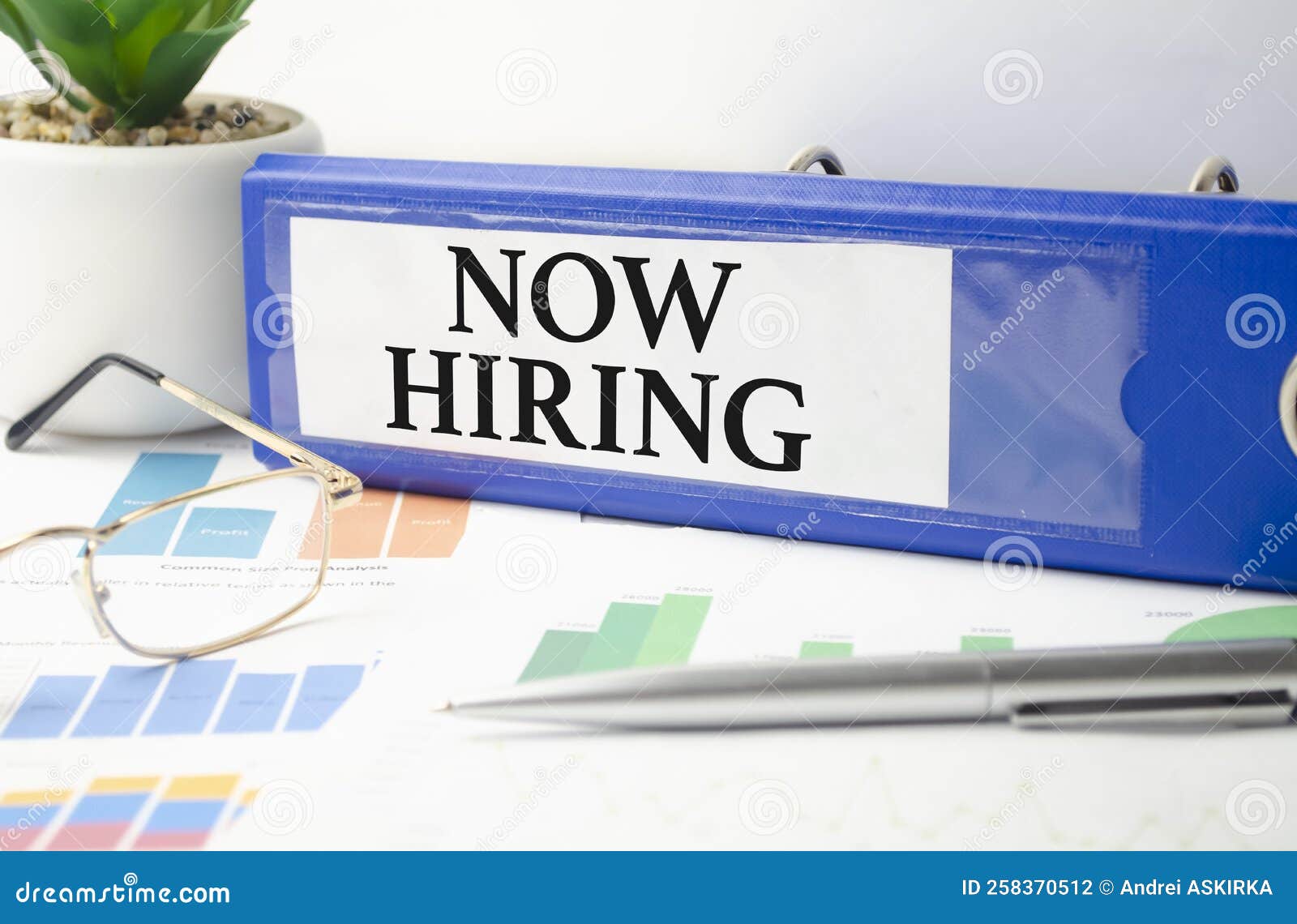Now Hiring Text Written on Blue Folder and Charts Stock Photo - Image ...
