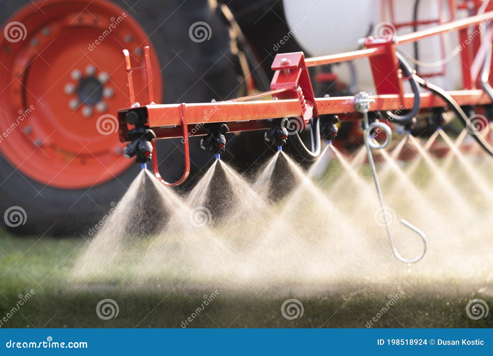 Nozzle Of The Tractor Sprinklers Stock Image | CartoonDealer.com #248643565