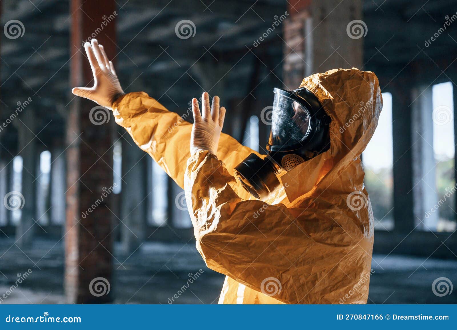 Nuclear Explosion. Man Dressed in Chemical Protection Suit in the Ruins ...