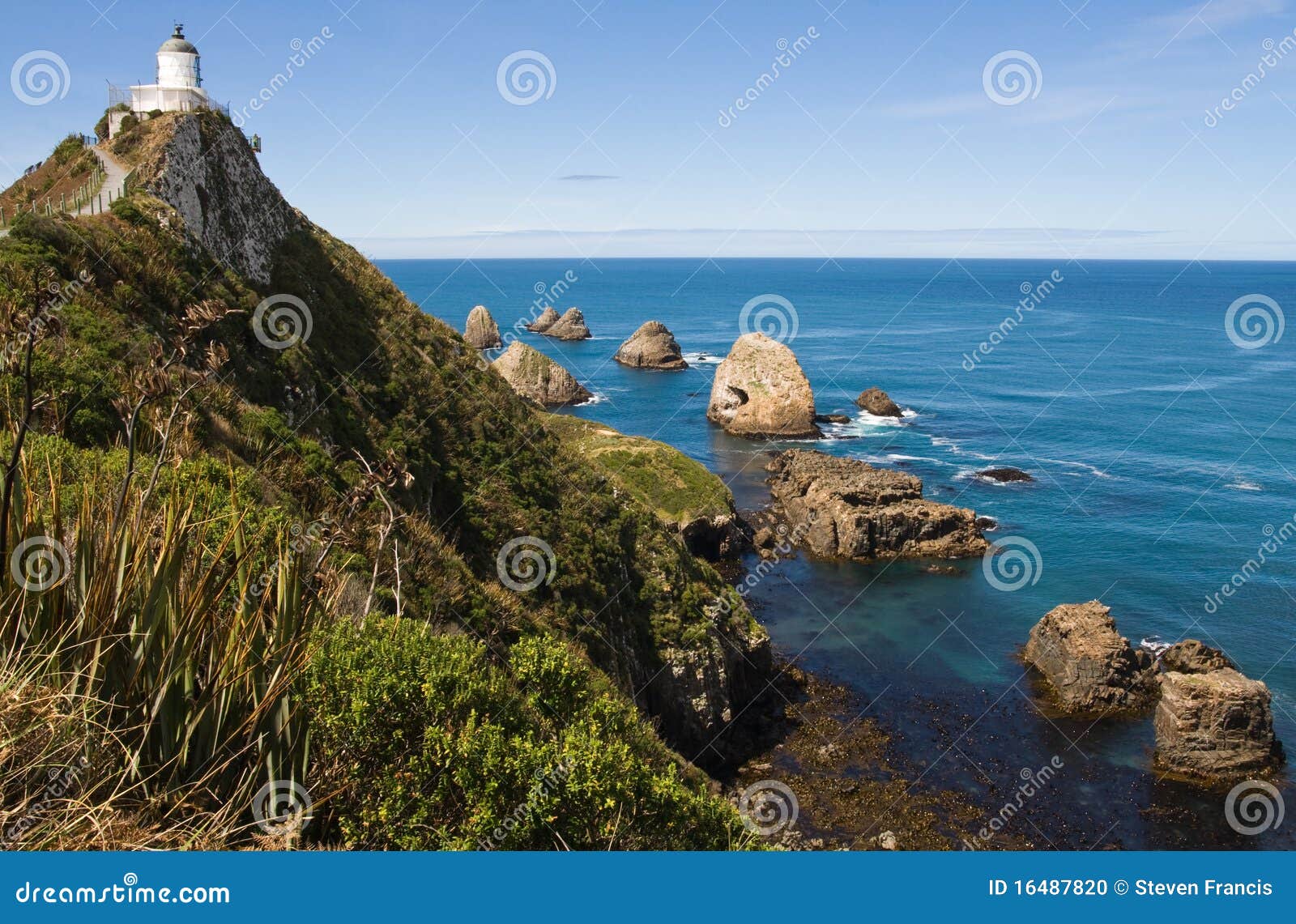 Nugget Point lighthouse stock photo. Image of hill, walkway - 16487820