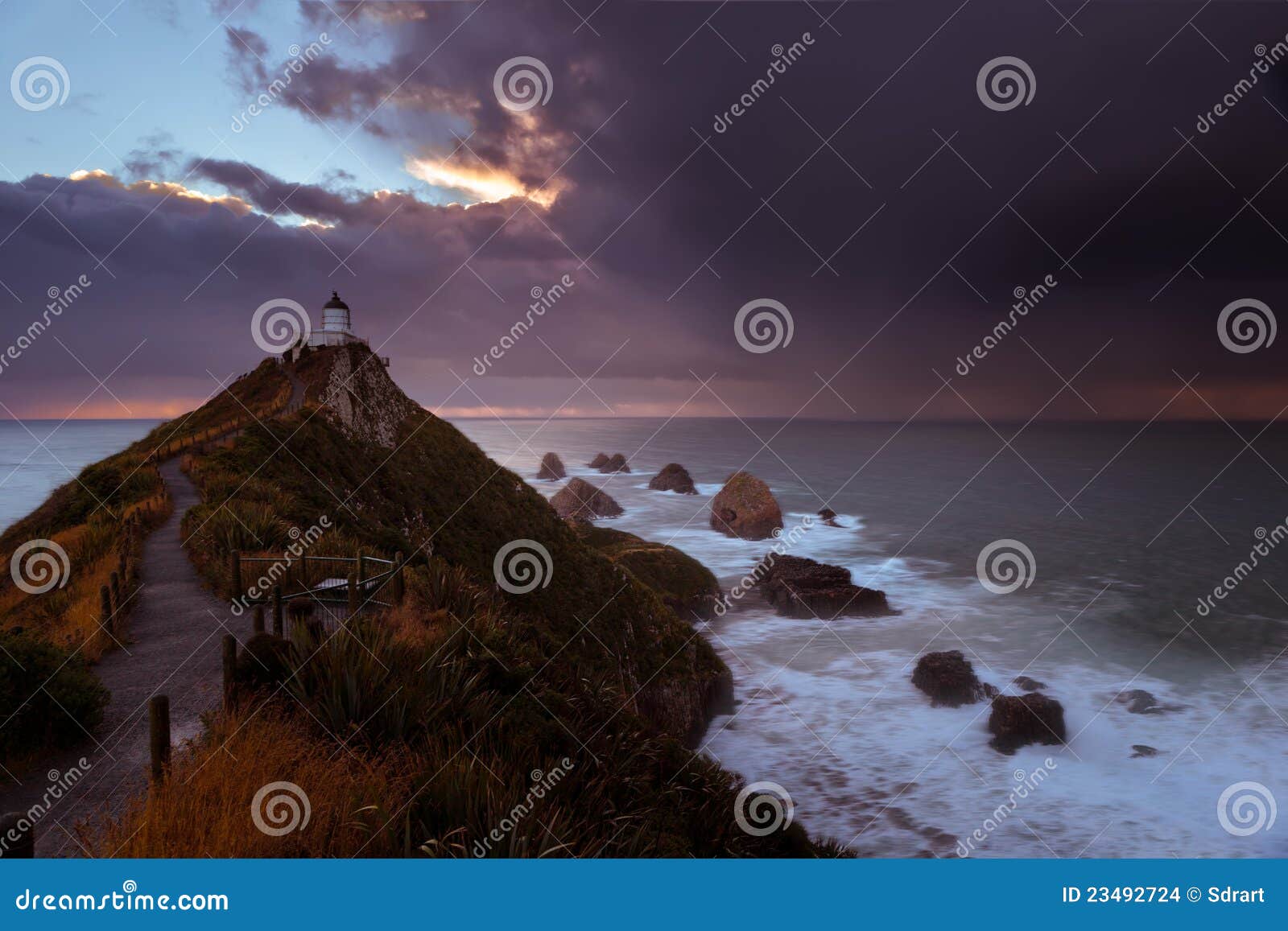 Nugget Point Lighthouse stock photo. Image of cliff, clouds - 23492724