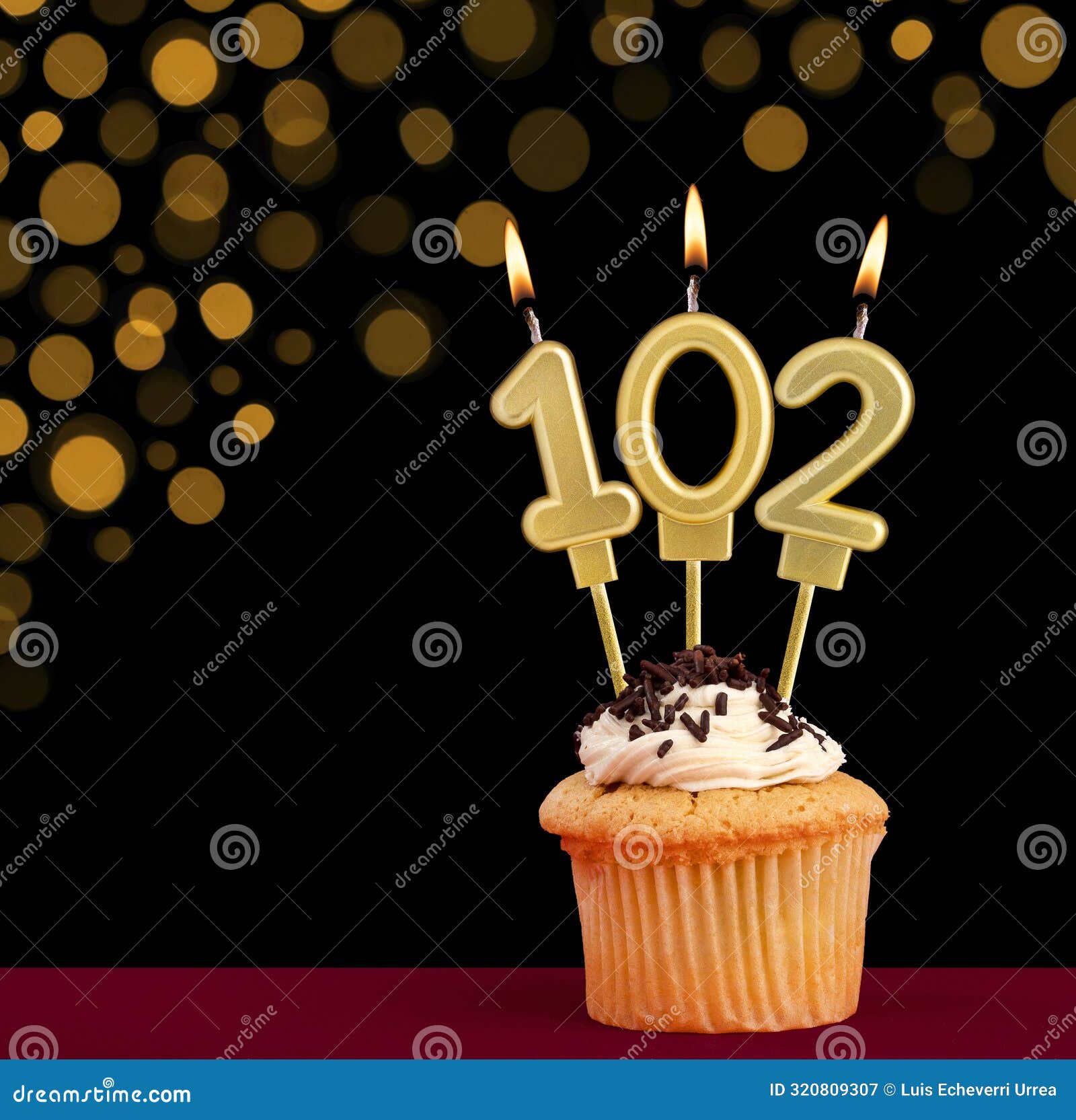 Number 102 Birthday Candle - Cupcake on Black Background with Out of ...
