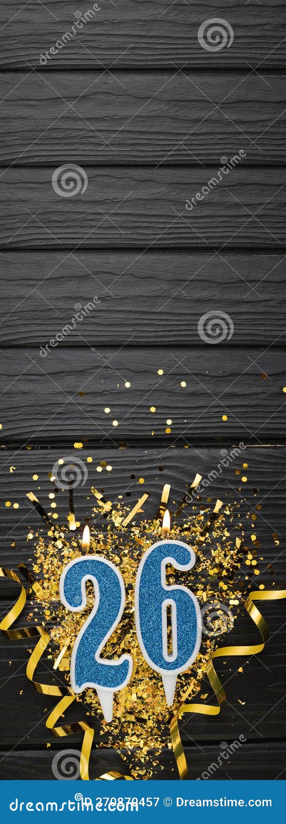 Number 26 Blue Celebration Candle And Gold Confetti On Dark Wooden