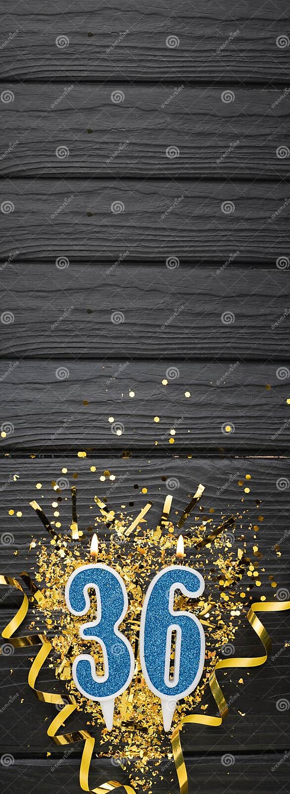 Number 36 Blue Celebration Candle And Gold Confetti On Dark Wooden