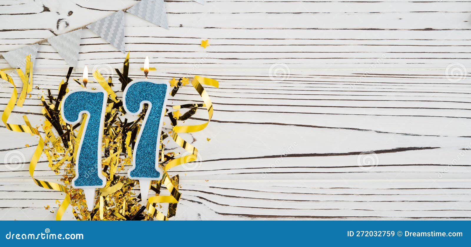 Number 77 Blue Celebration Candle On White Wooden Background With