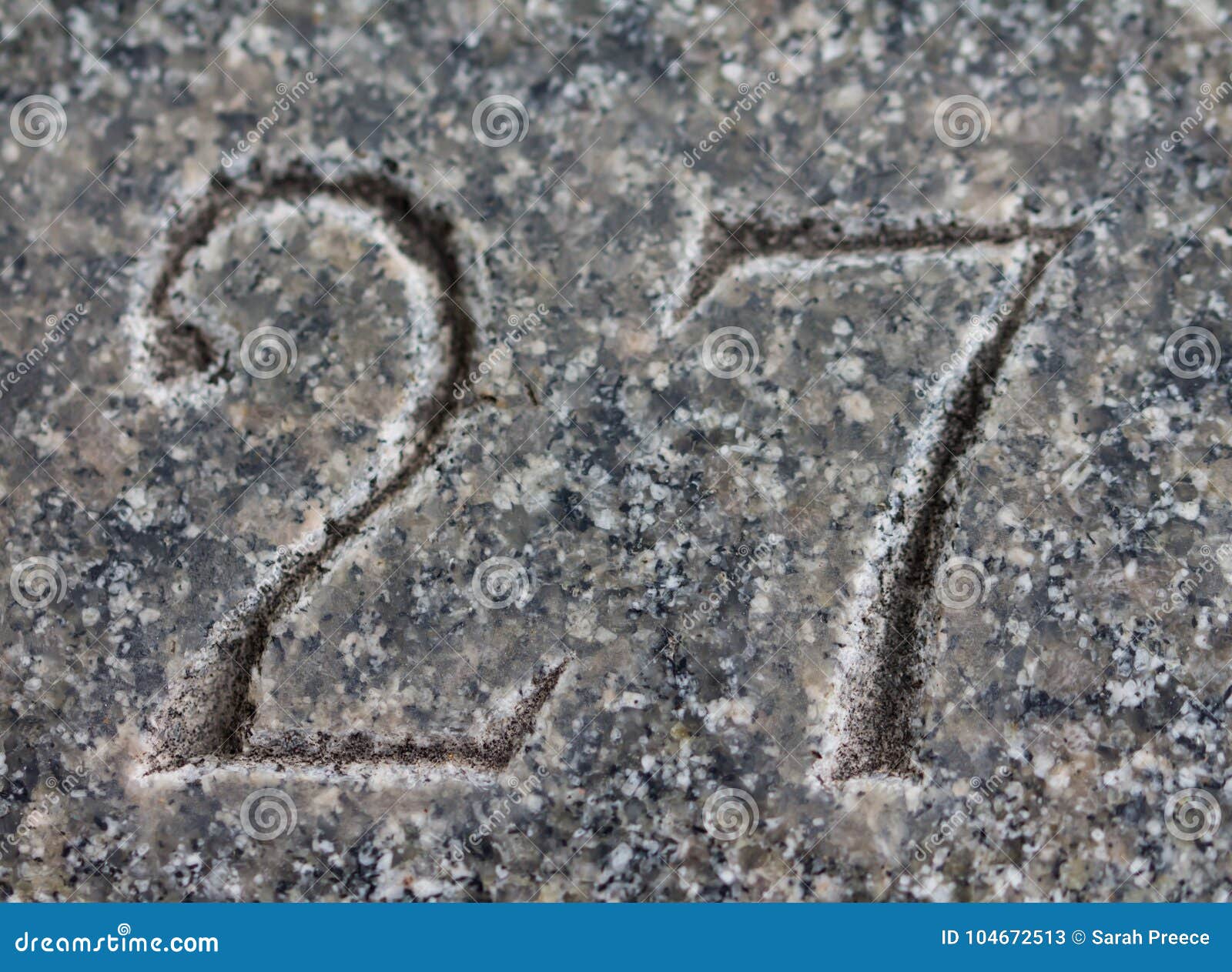 Number 27 carved in stone stock image. Image of surface - 104672513