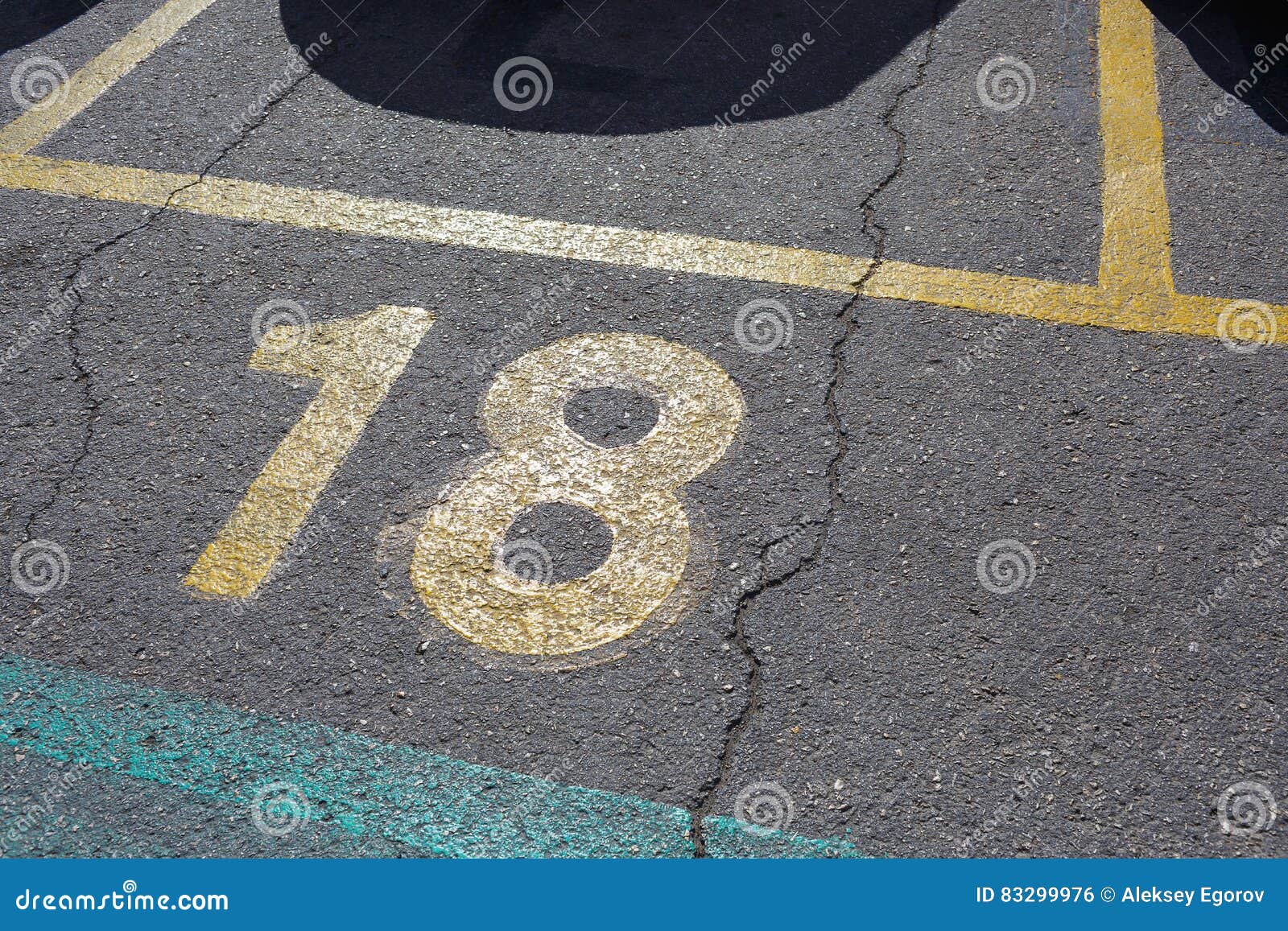 Number Eighteen Parking Slot Stock Photo - Image of dark, backgrounds ...