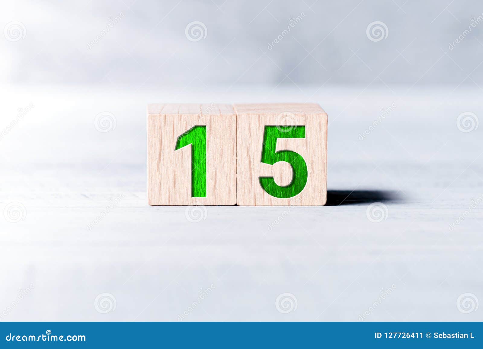 Number 15 Formed by Wooden Blocks on a White Table Stock Image - Image ...
