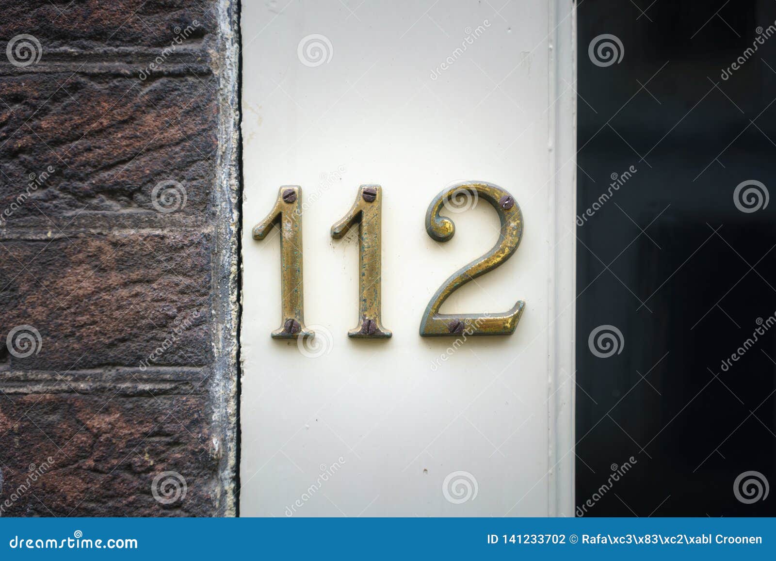 House number 112 stock photo. Image of bronze, numerals - 141233702