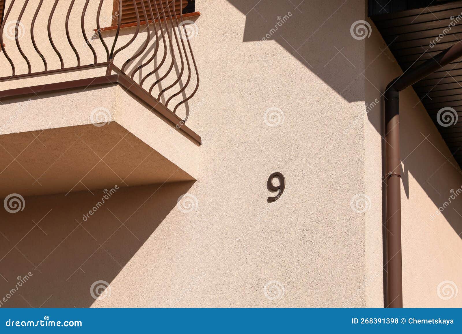 Number Nine on Beige House with Balcony Outdoors Stock Photo - Image of ...