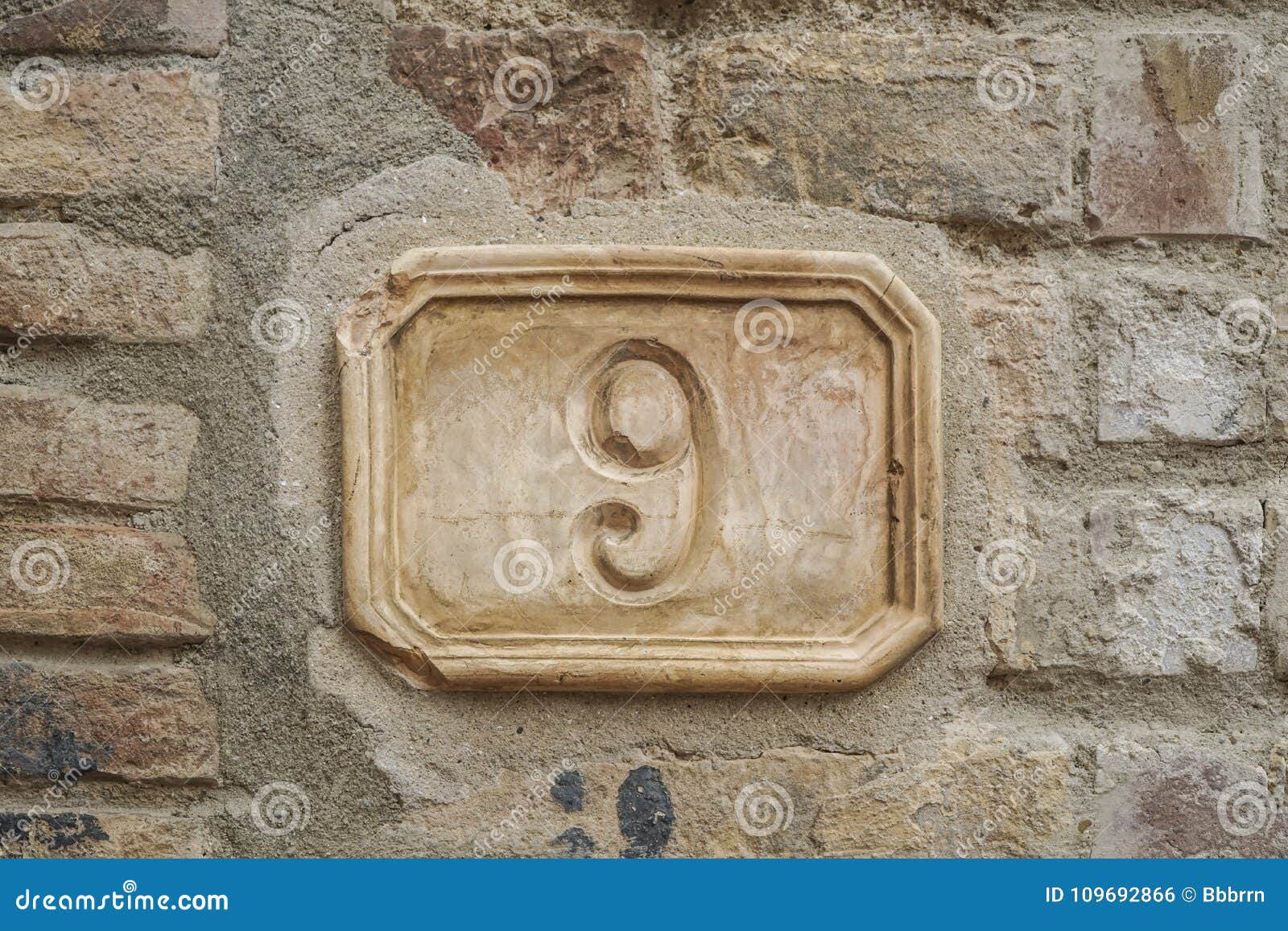 Number nine on a wall stock photo. Image of exterior - 109692866