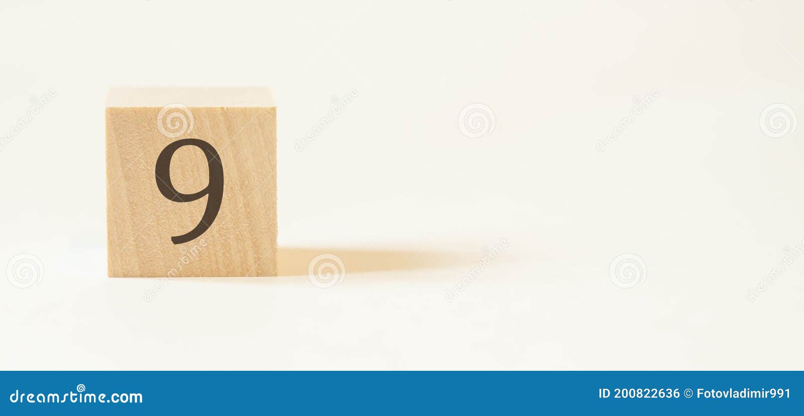 Number Nine on a Wooden Cube with a White Background Stock Photo ...