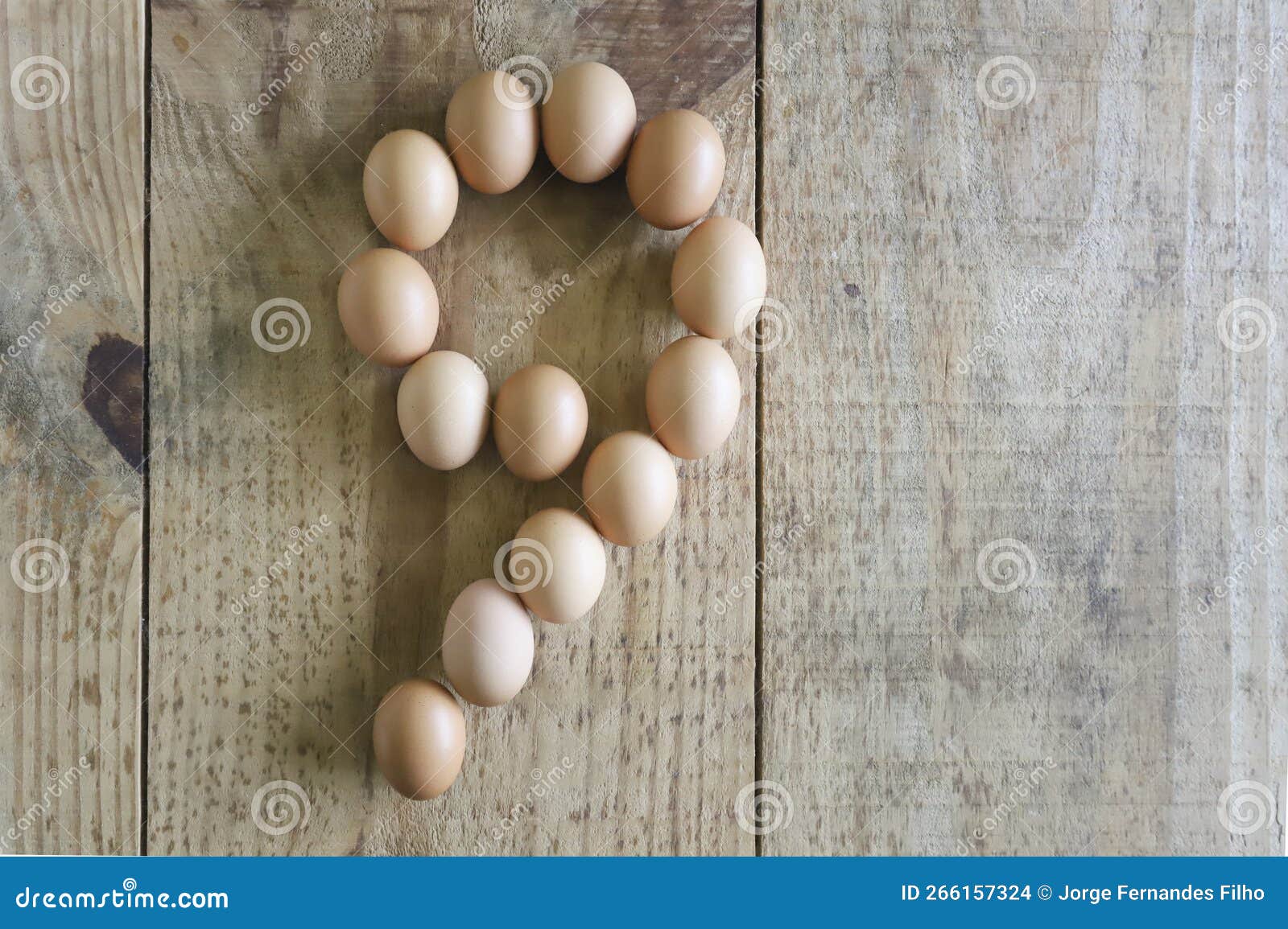 Number Nine Written with Chicken Eggs, Arranged on a Rustic Pine Wood ...