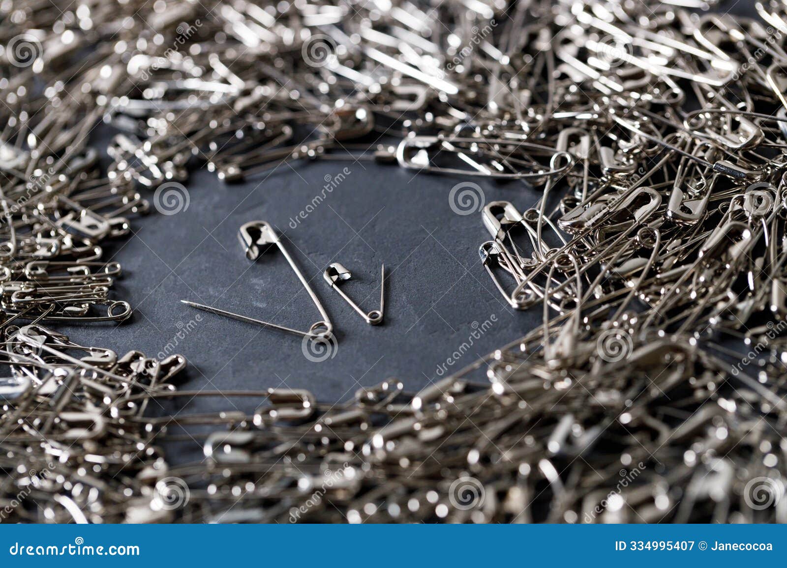 A Number of Stainless Safety Pins on Black Stone Background Stock Image ...