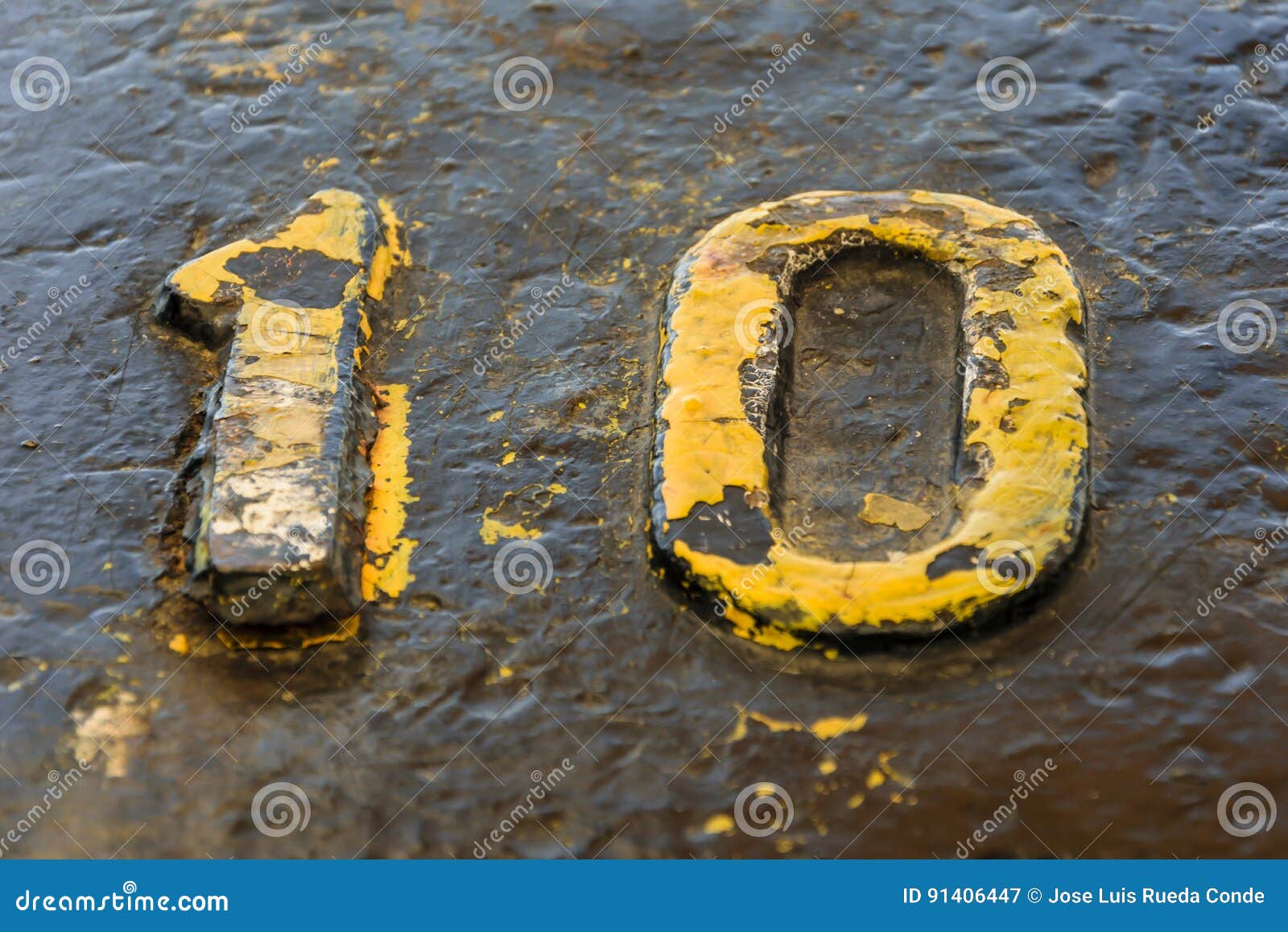 A Number Ten Yellow on a Bollard Stock Image - Image of rusted ...