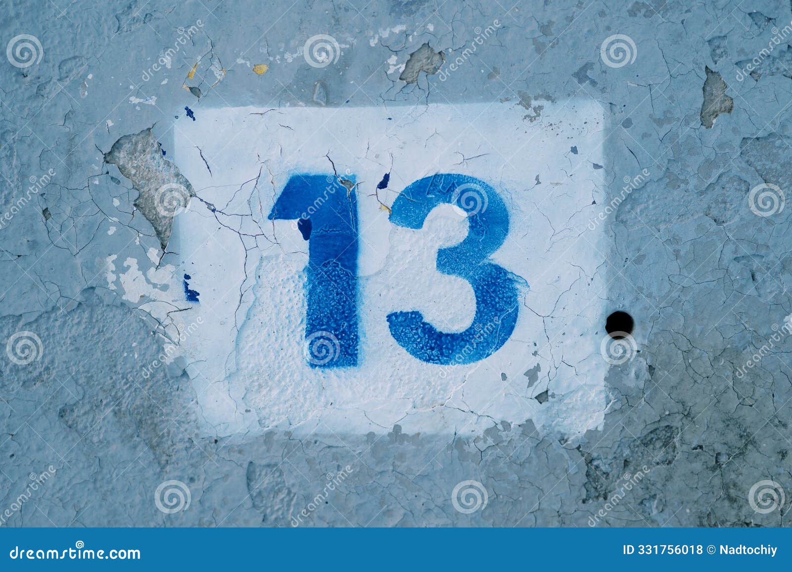 Number Thirteen Drawn in a White Rectangle on a Blue Peeling Wall Stock ...