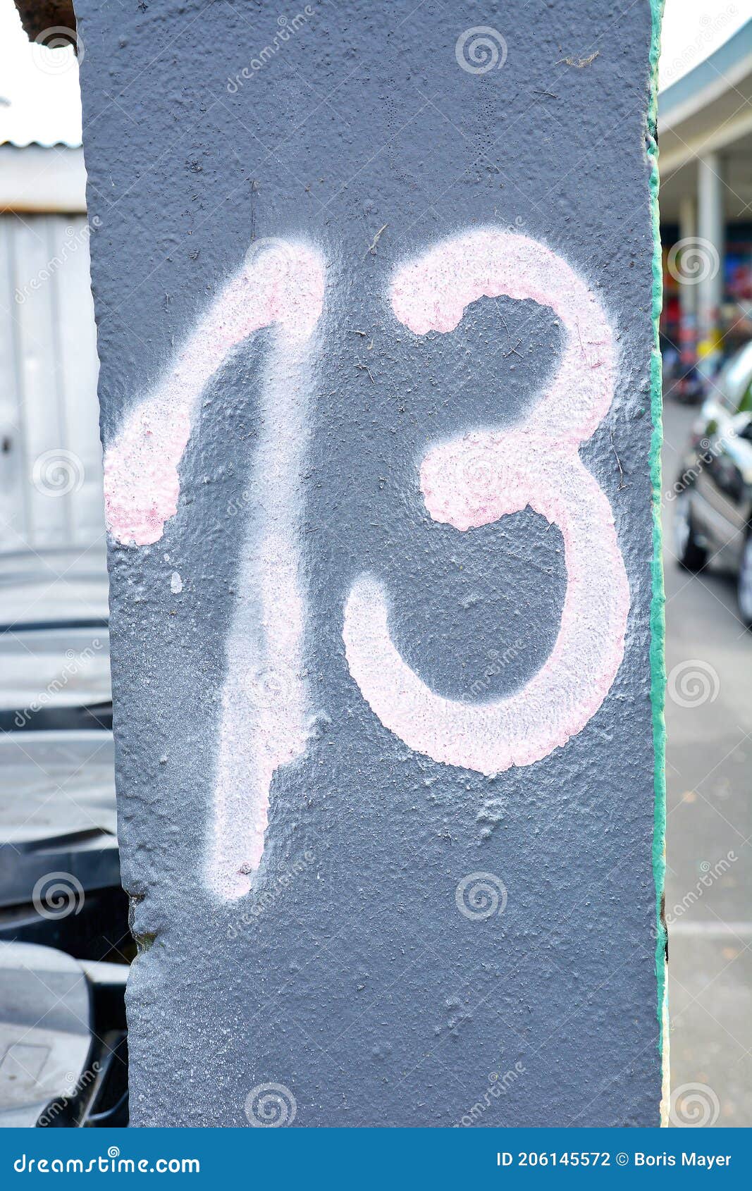 Number Thirteen, Painted in White on a Grey Pile Stock Photo - Image of ...