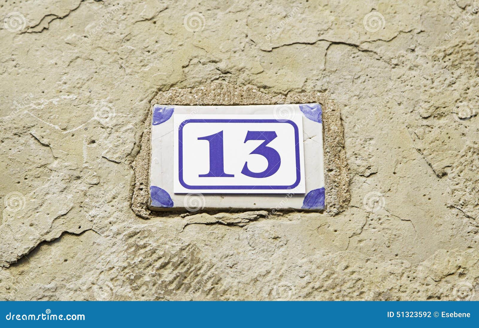 Number thirteen on a wall stock photo. Image of door - 51323592