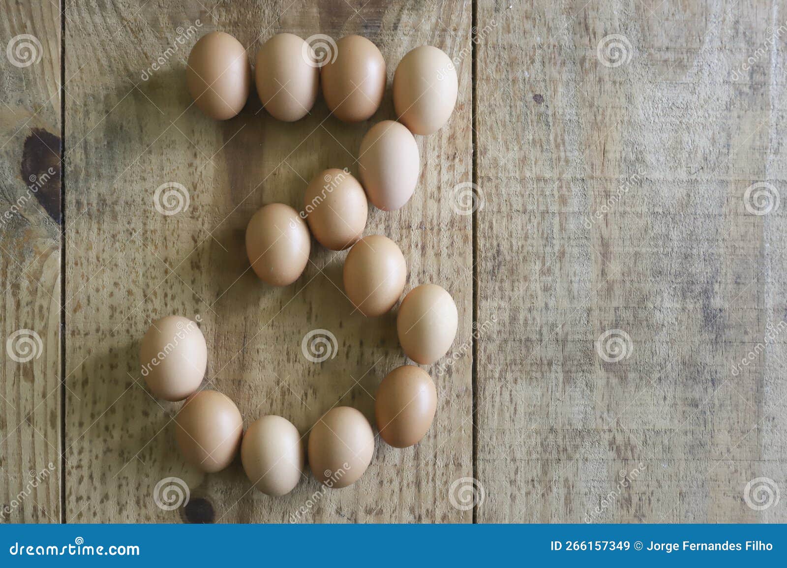 Number Three Written with Chicken Eggs, Arranged on a Rustic Pine Wood ...