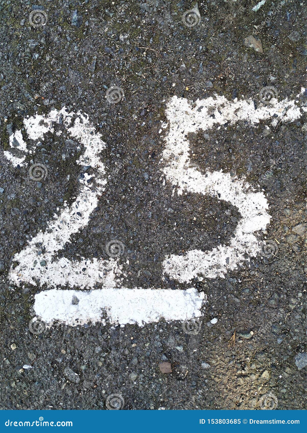 The Number Twenty-five is Written in White Paint on the Gray Asphalt ...