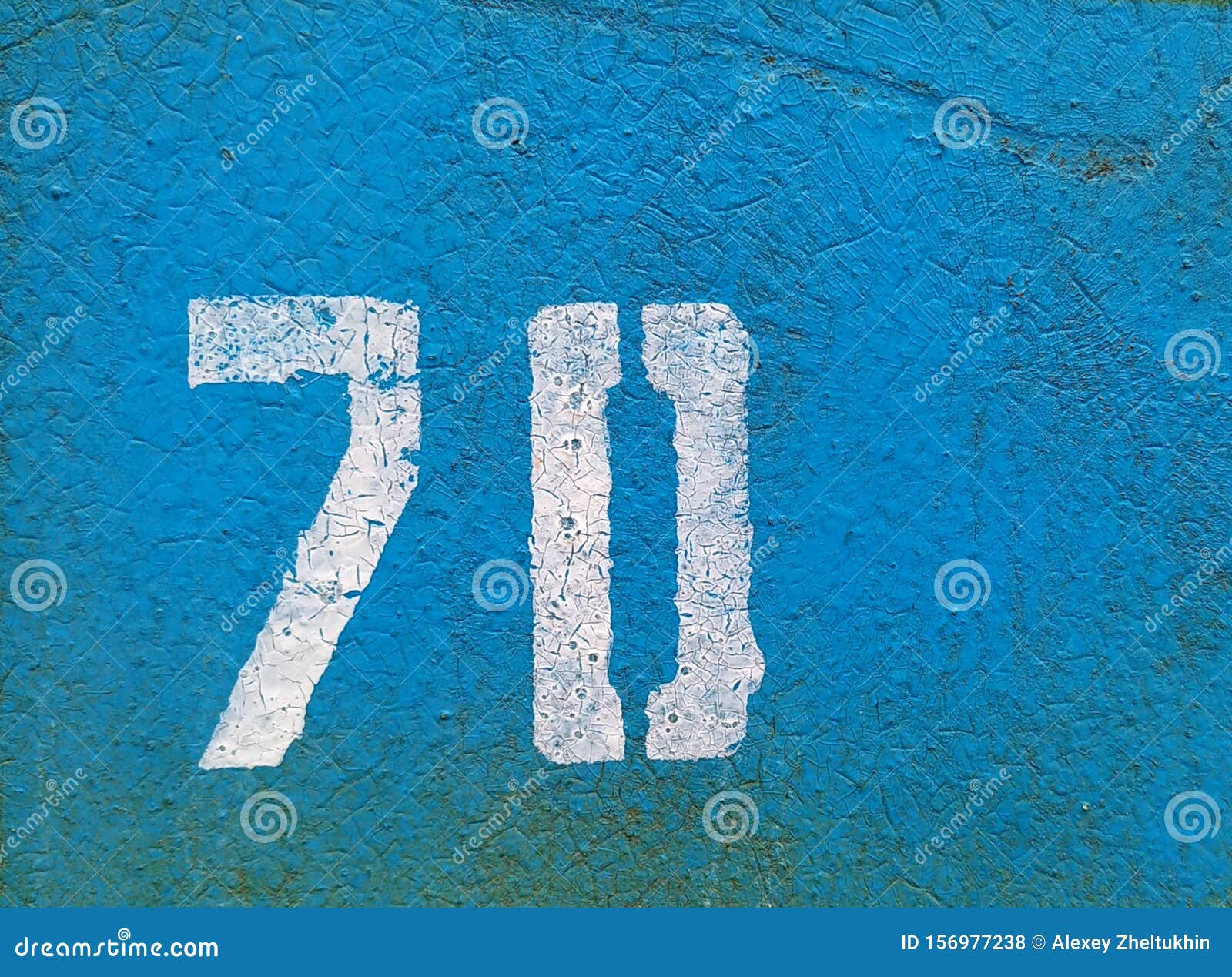 The Number 70 with White Paint on a Cracked Blue Background. Close-up ...