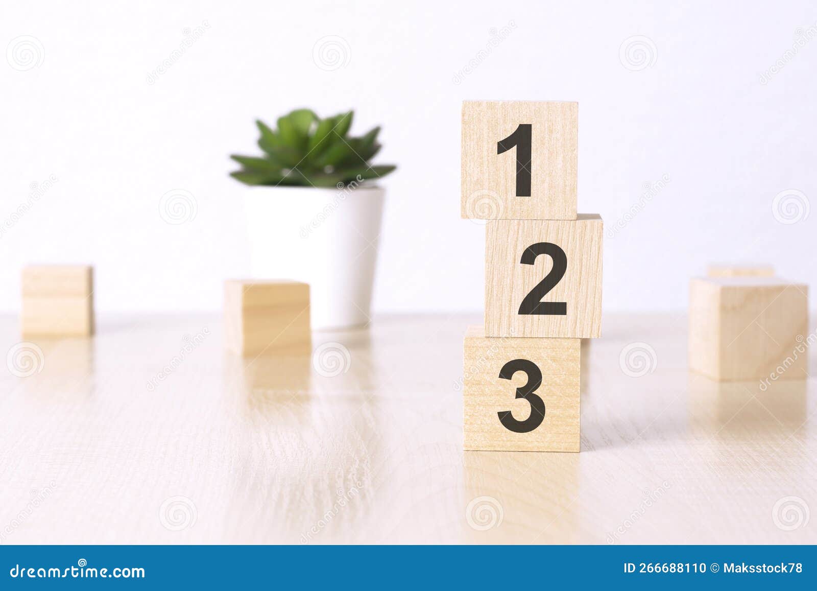 Numbers 123 on Wooden Cubes Standing on Top of Each Other Stock Photo ...