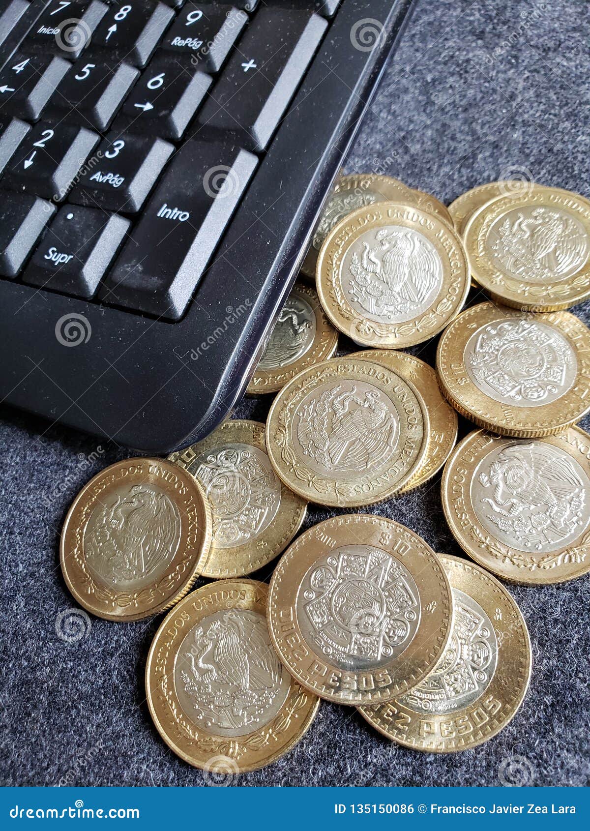 Numeric Keypad of a Computer and Bunch of Mexican Coins of Ten Pesos on ...