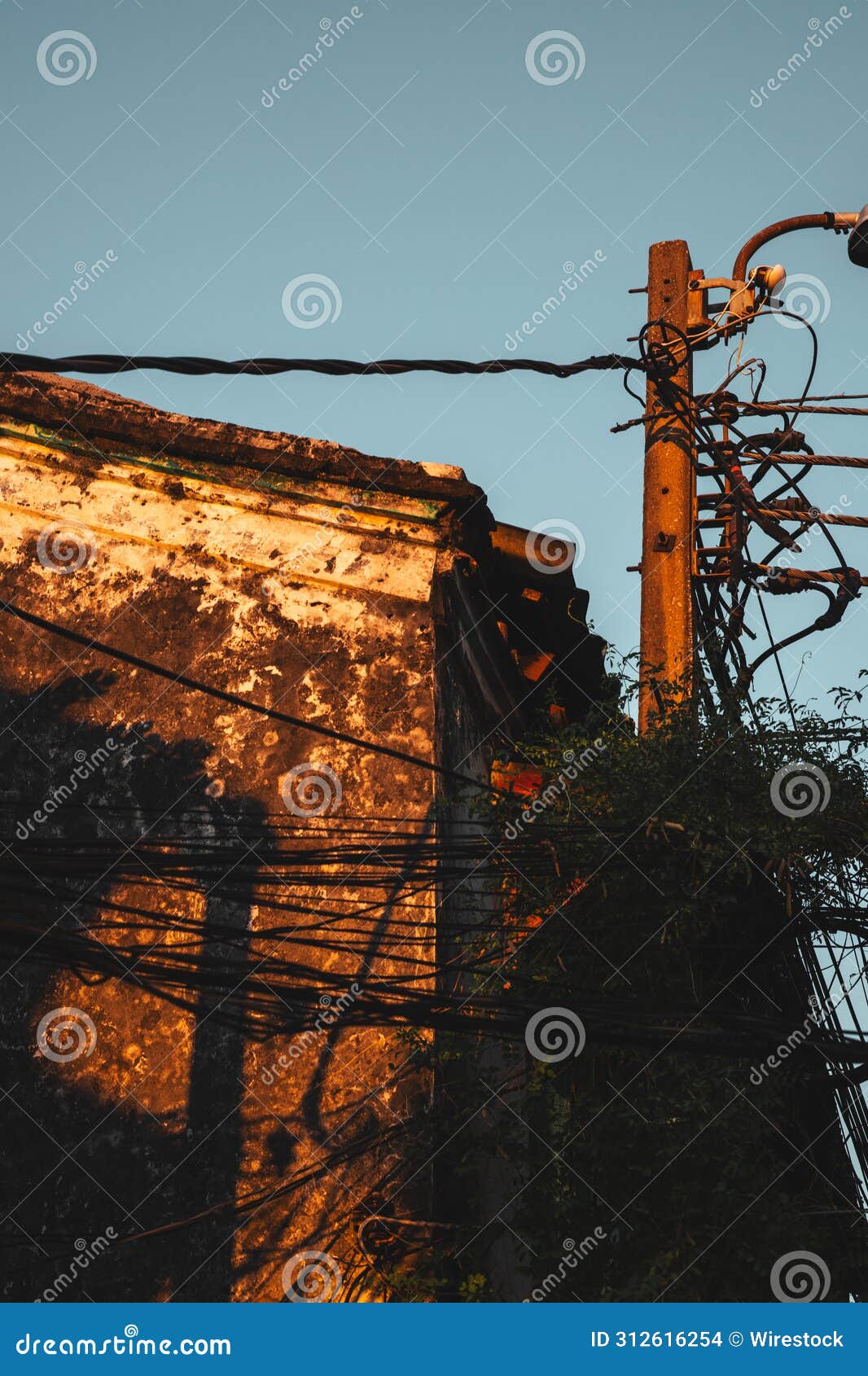 Numerous Electrical Wires Dangle from a Building S Side. Stock Photo ...