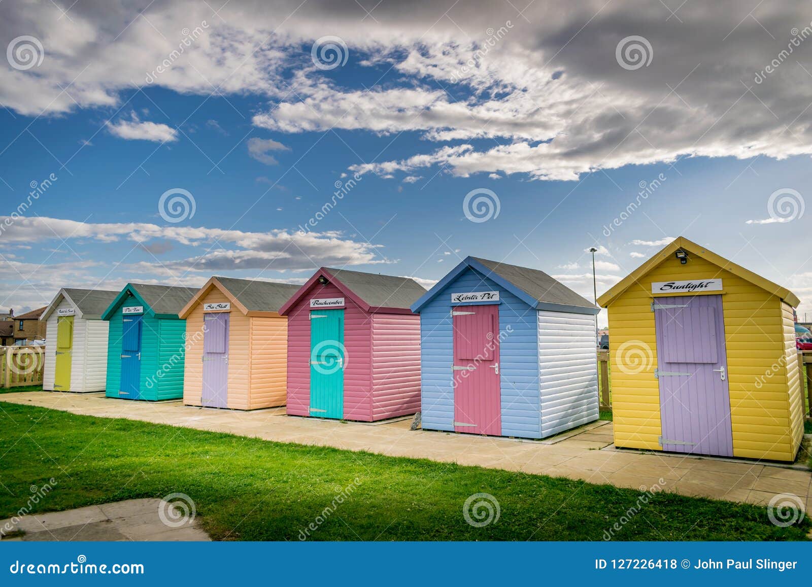 Numerous Multi Coloured Beach Huts Stock Photo - Image of clothing ...