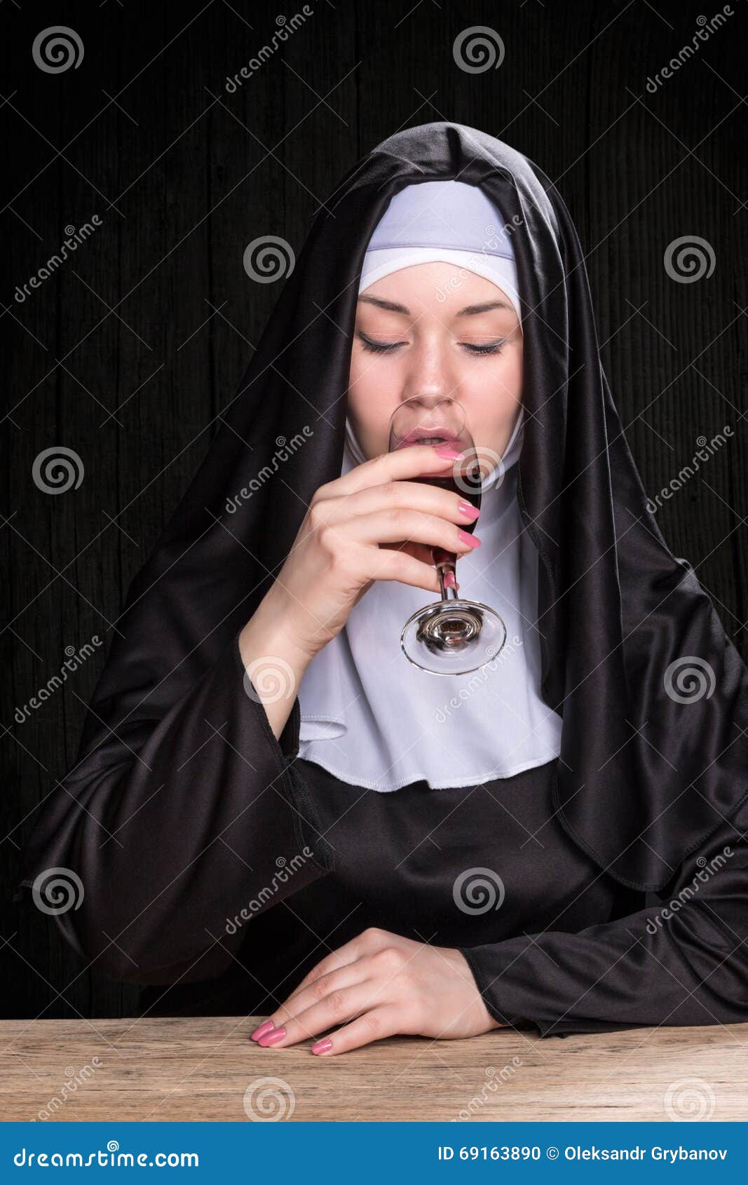Nun drinking wine stock photo. Image of portrait, attractive - 69163890