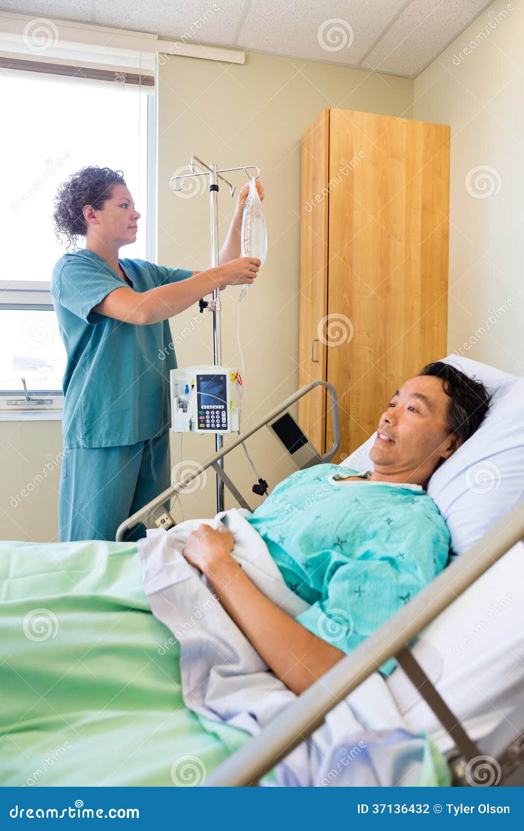 Nurse Adjusting IV Drip on Rod with Patient on Stock Photo - Image of ... Nurse Adjusting IV Drip on Rod with Patient on Stock Photo - Image of ...