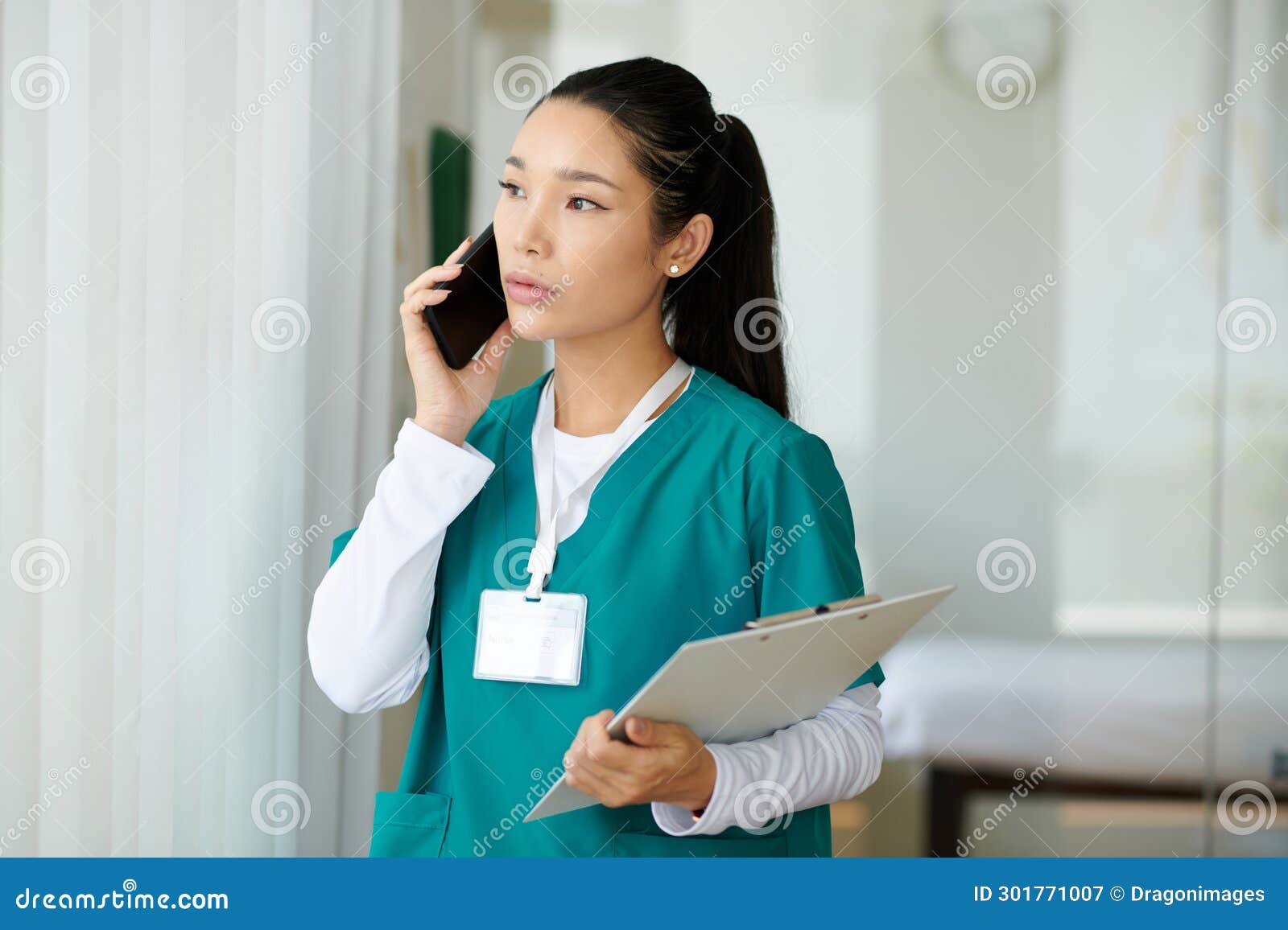 Nurse Answering Phone Call from Patient Stock Image - Image of ...