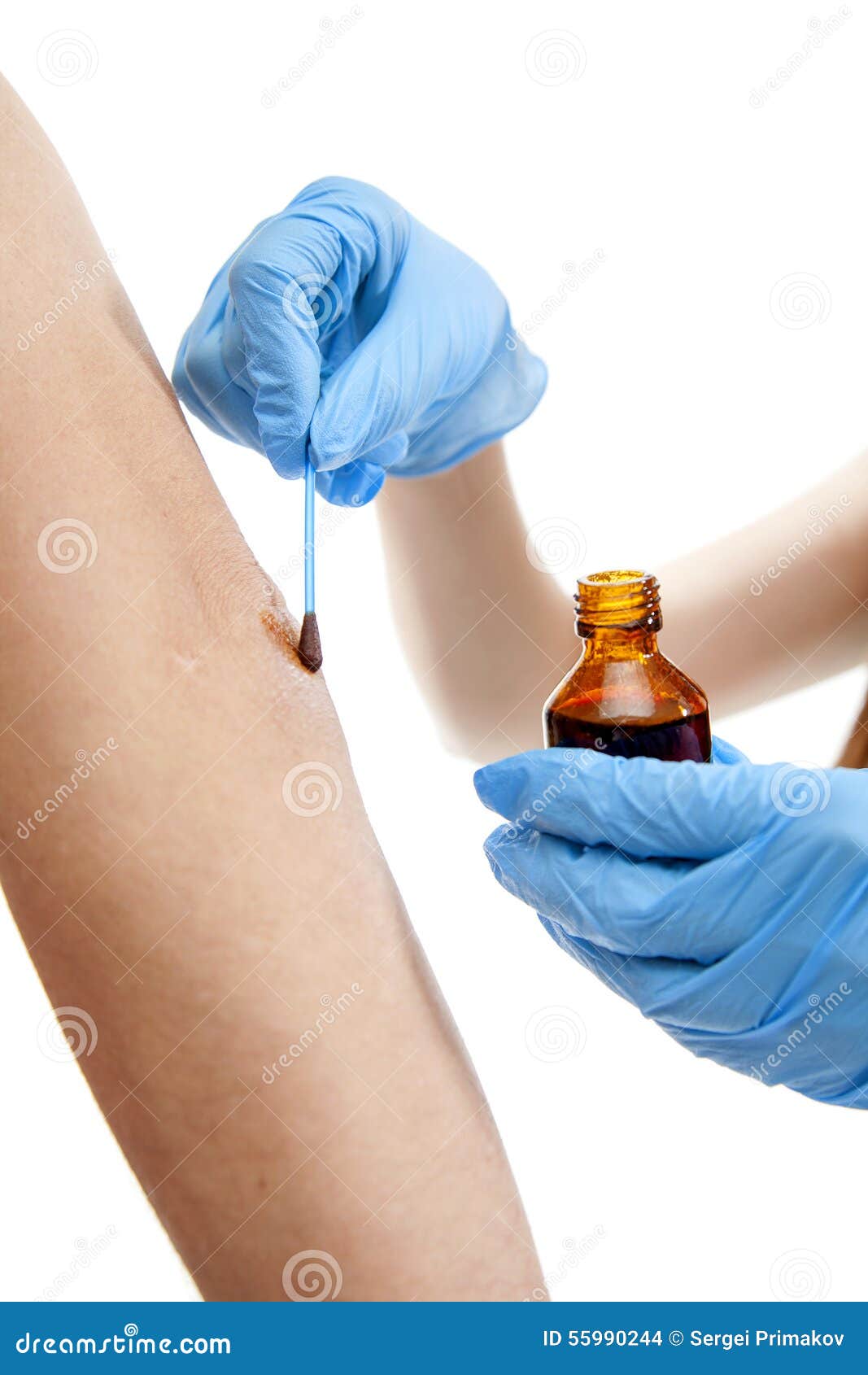 Nurse applying iodine stock photo. Image of examination - 55990244