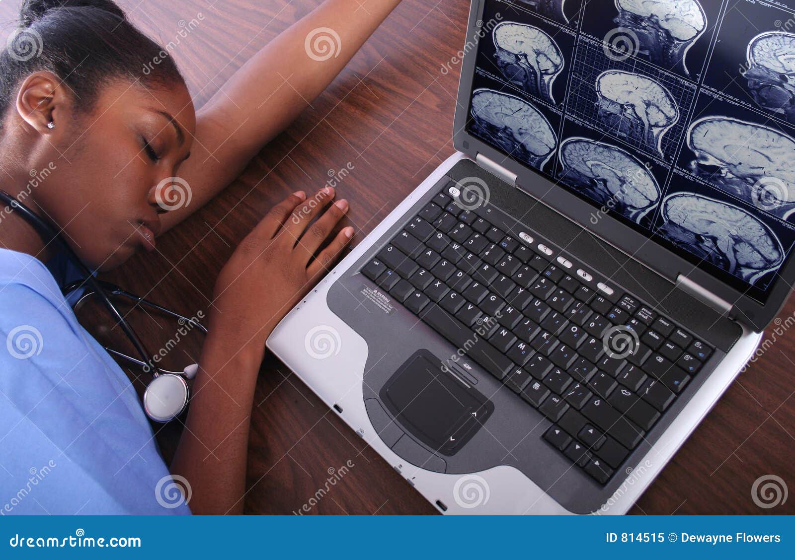 Nurse Asleep at Computer stock image. Image of african - 814515