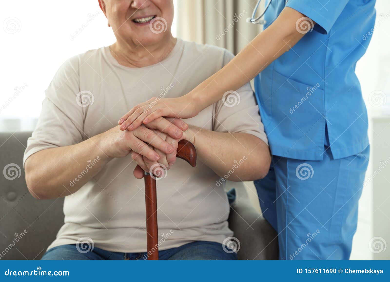 Nurse Assisting Elderly Man with Cane Indoors Stock Photo - Image of ...