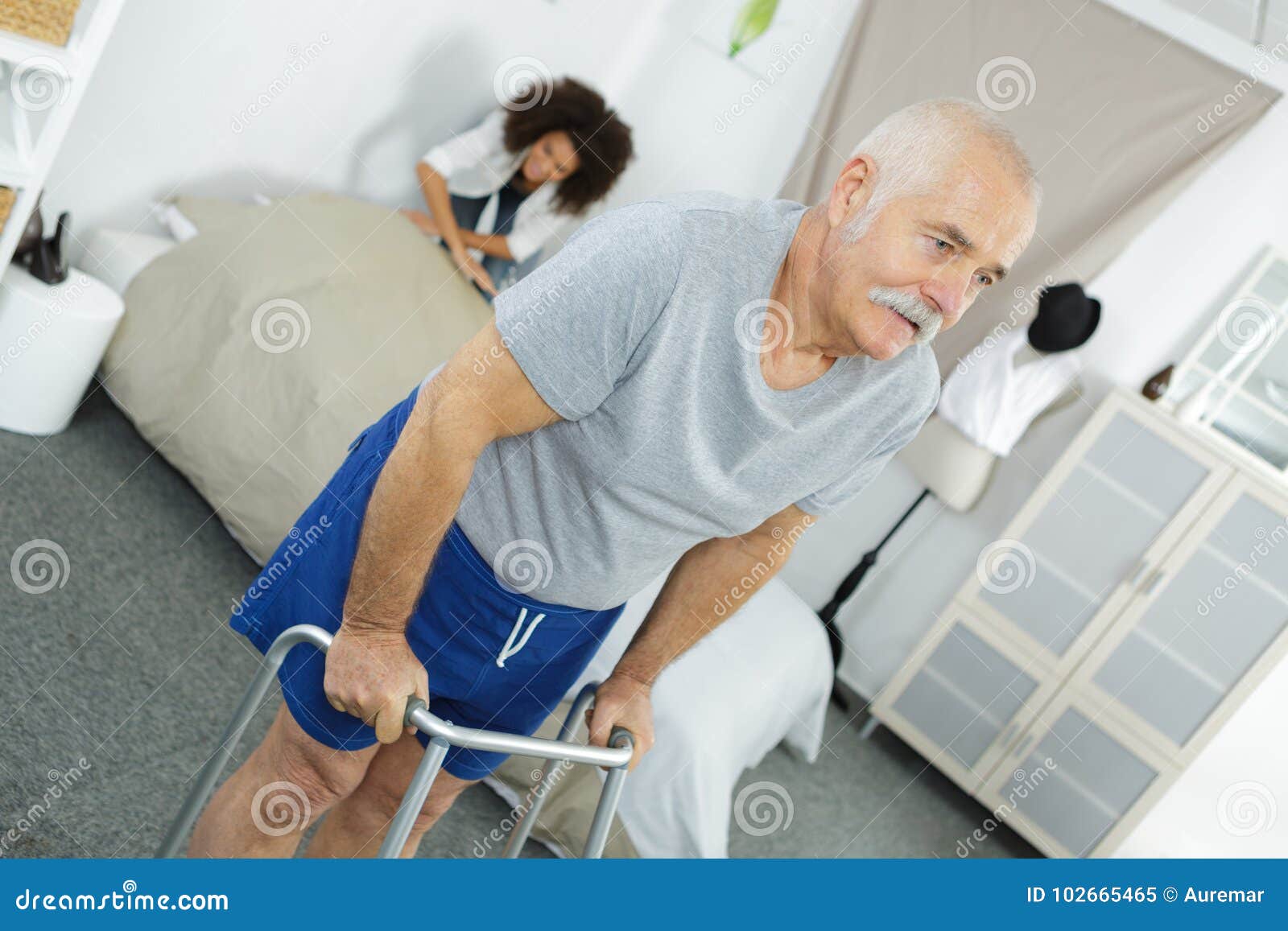 Nurse Assisting Elderly Man With Walking Frame Stock Image Image Of