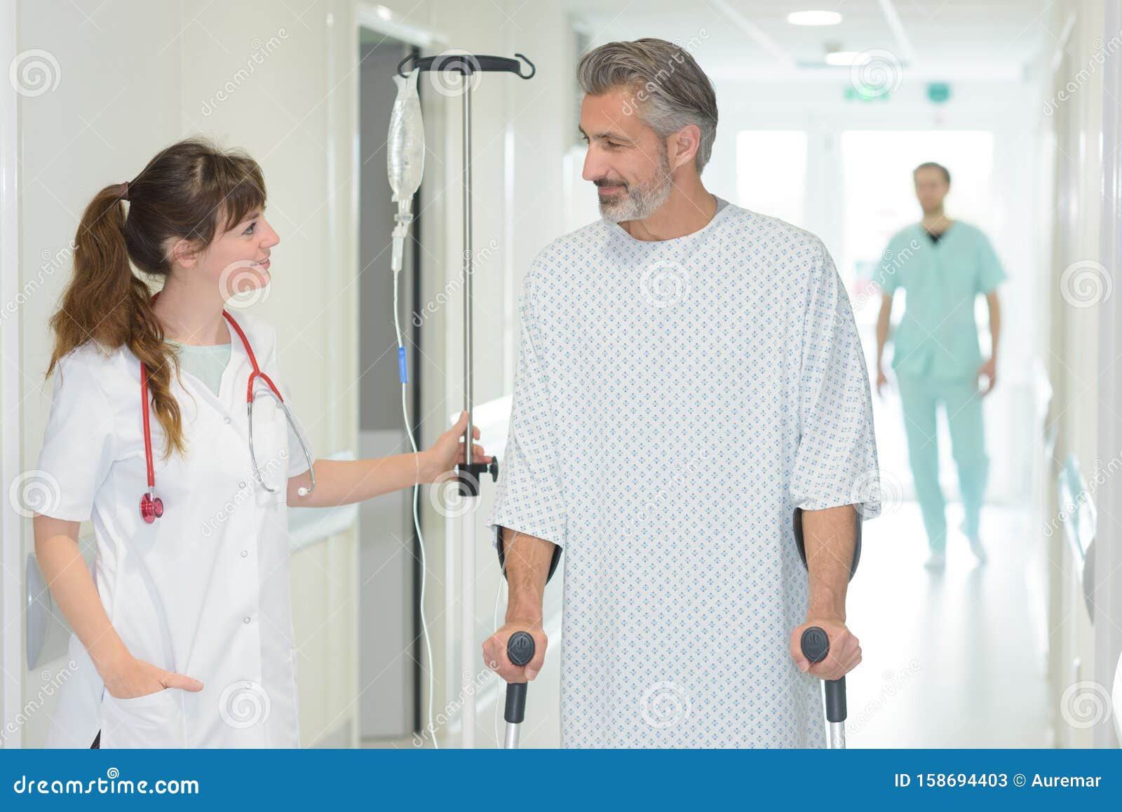 Nurse assisting patient stock image. Image of patient - 158694403