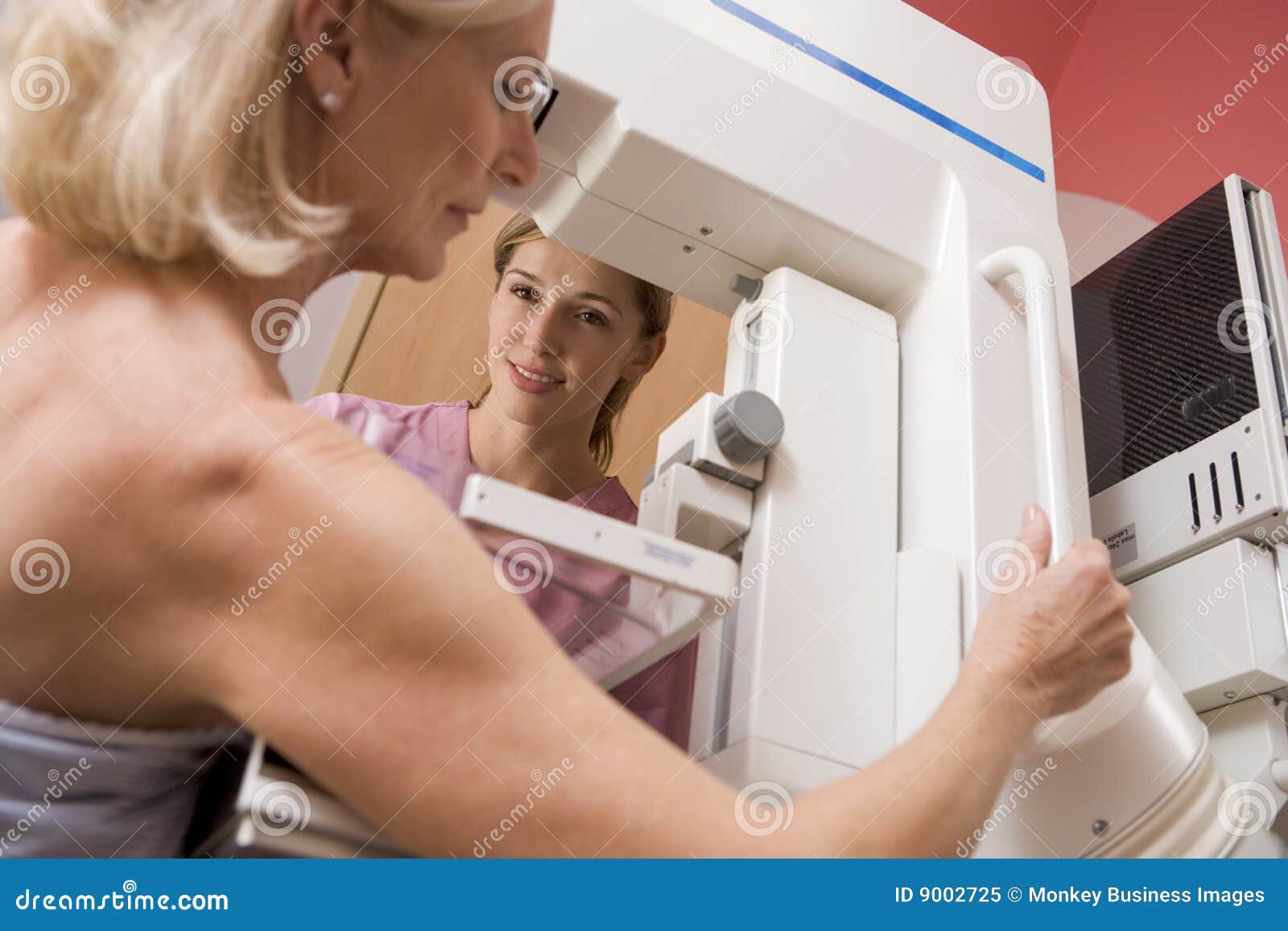 Nurse Assisting Patient Undergoing Mammogram Stock Image - Image of ...
