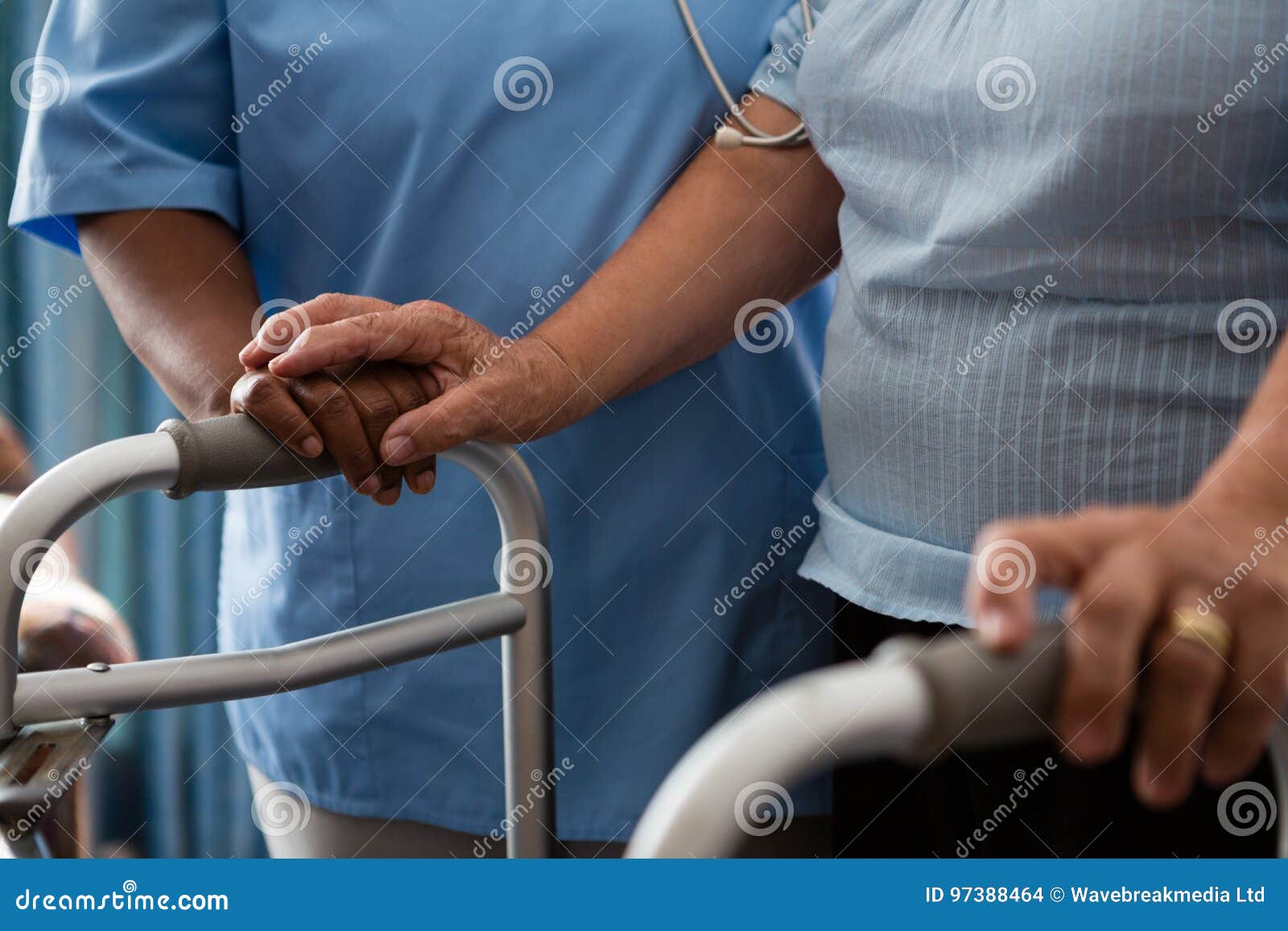 Nurse Assisting Senior Patient in Walking with Walker at Nursing Home ...