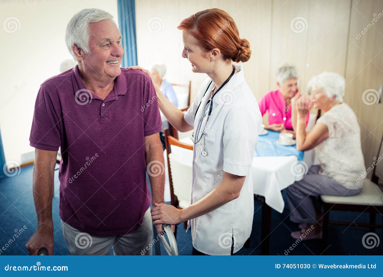 Nurse Assisting a Senior Using a Walker Stock Photo - Image of ...