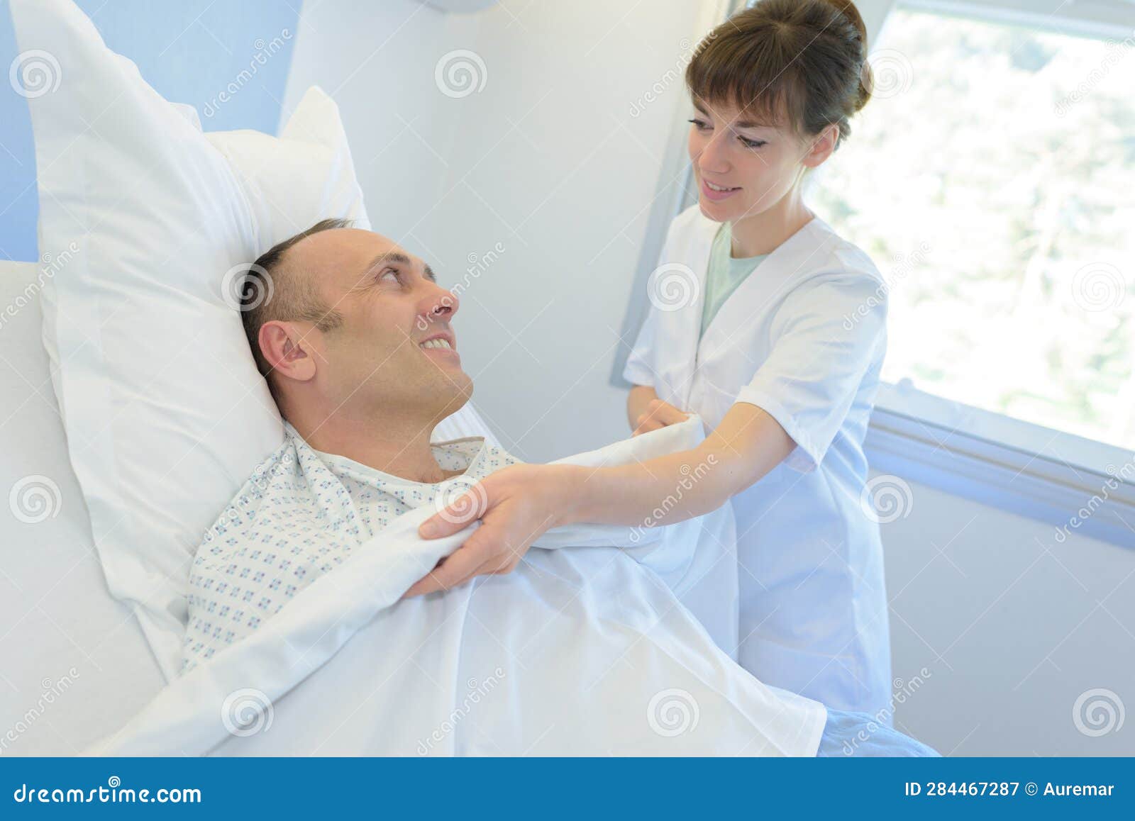 Nurse caring for patient stock image. Image of disease - 284467287