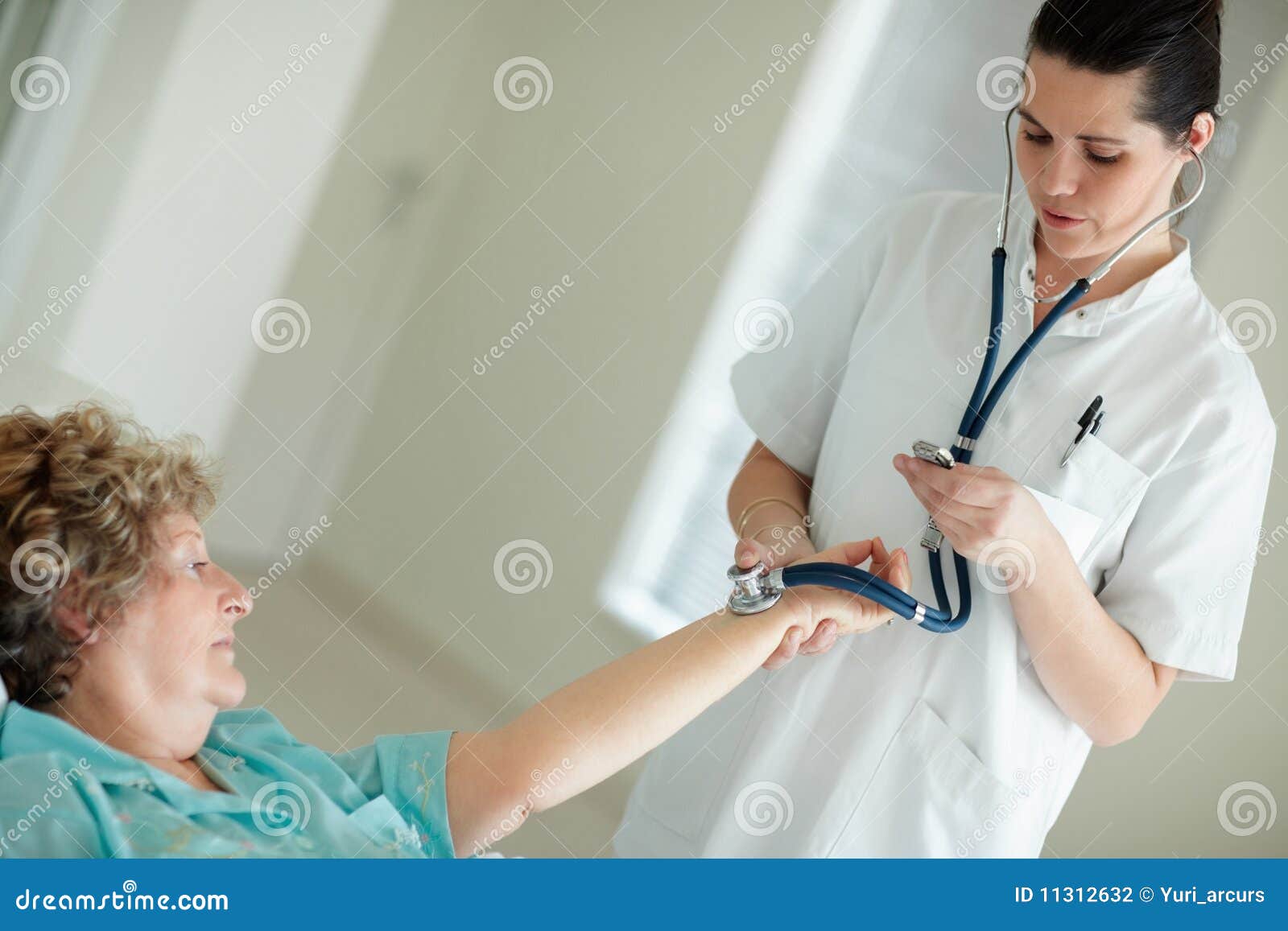 Nurse Checking the Pulse of an Old Patient Stock Photo - Image of ...