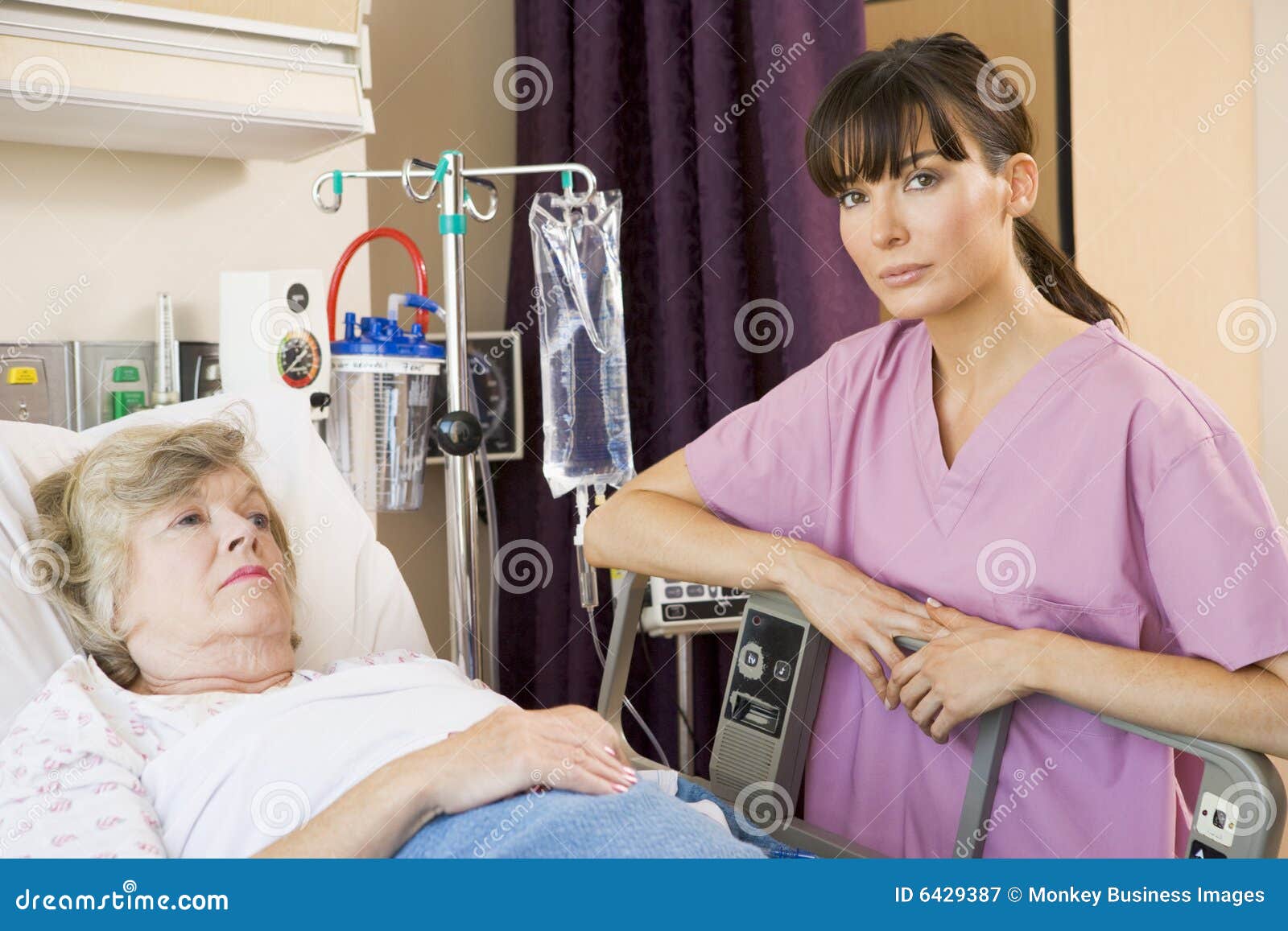 Nurse Checking Up on Patient Lying in Hospital Bed Stock Image - Image ...