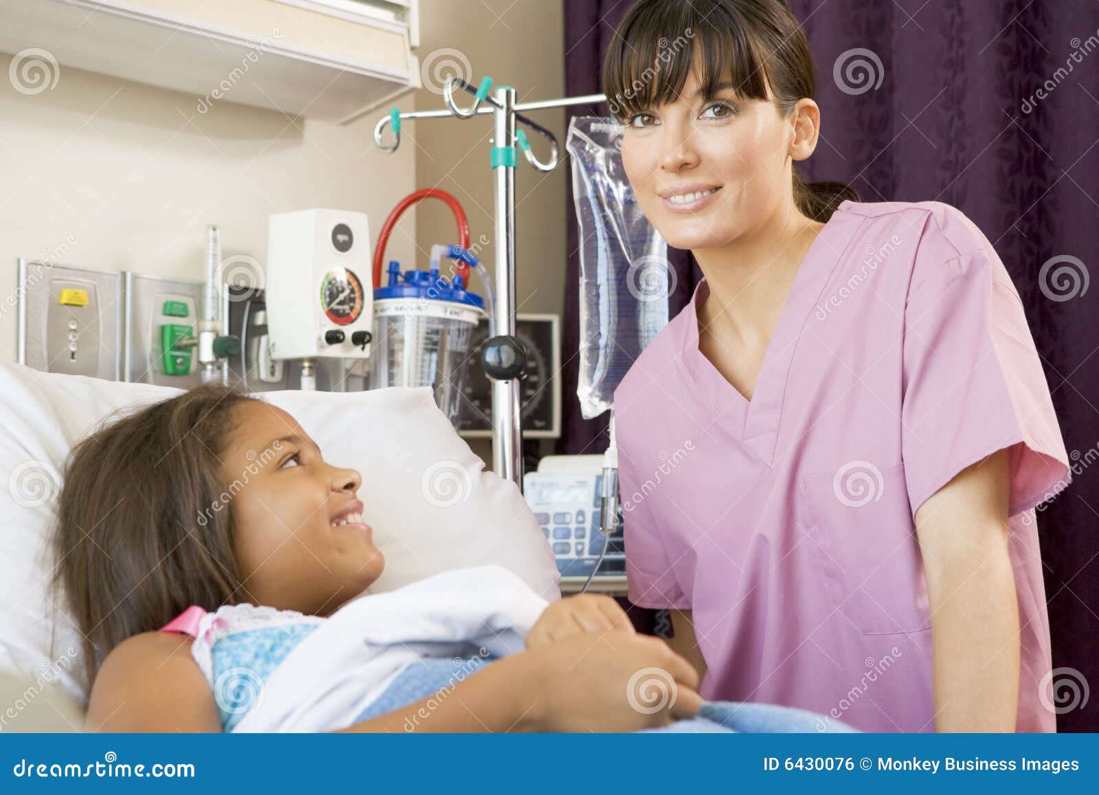 Nurse Checking Up on Young Patient Stock Photo - Image of caring ...