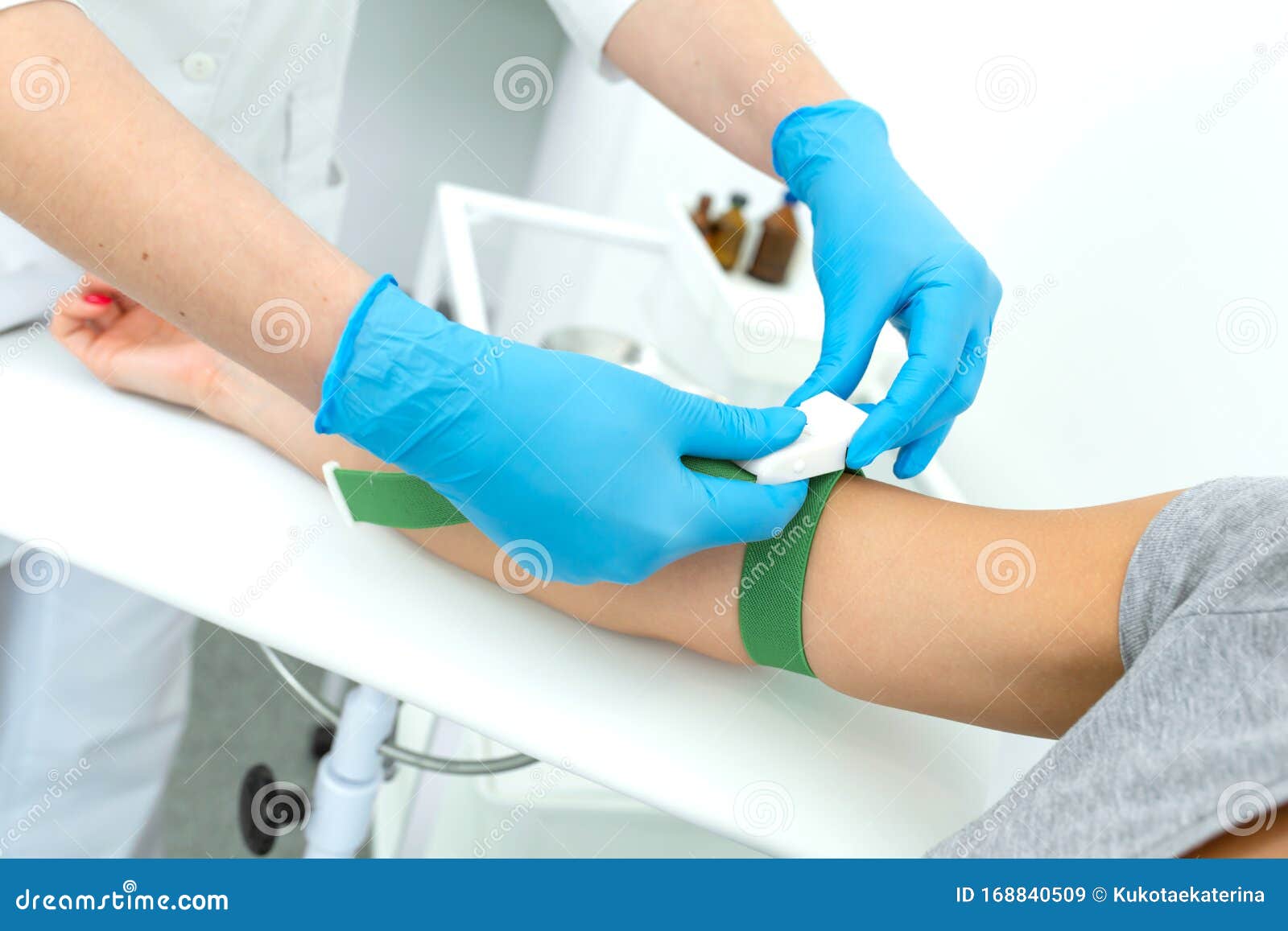 The Nurse Fastens The Clip On The Patient Hand Before The Blood ...