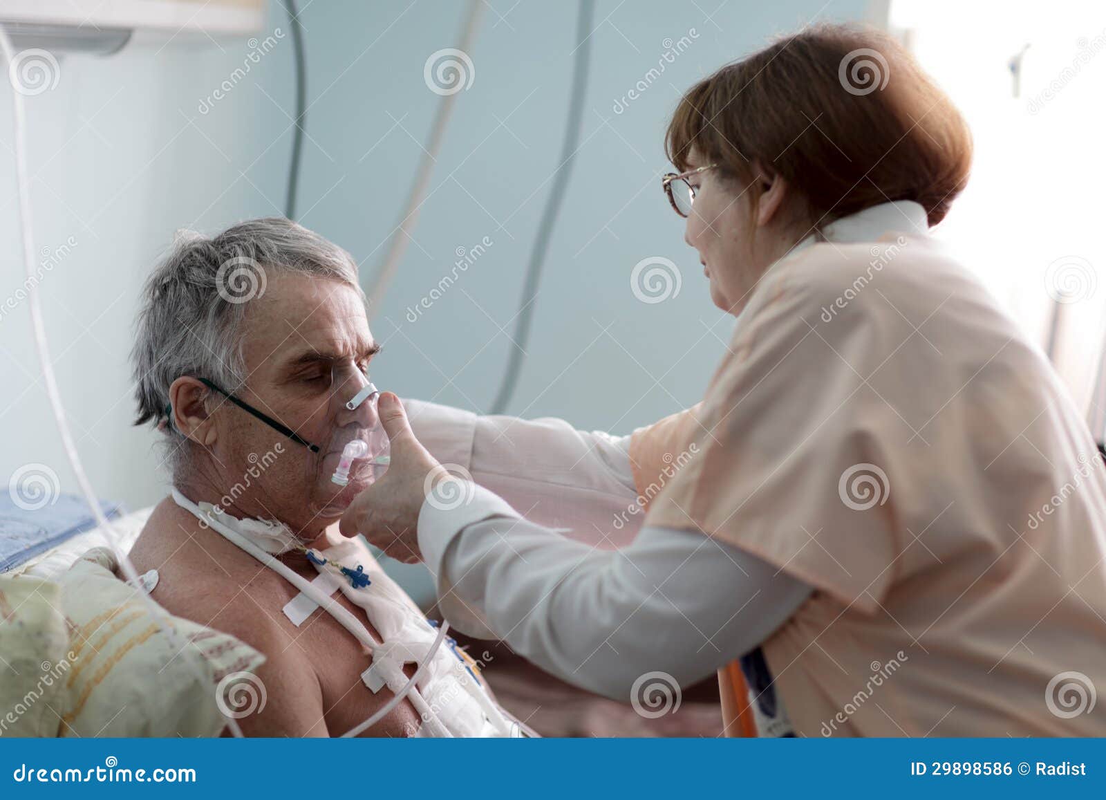 Nurse fixing oxygen mask stock photo. Image of inhaling - 29898586