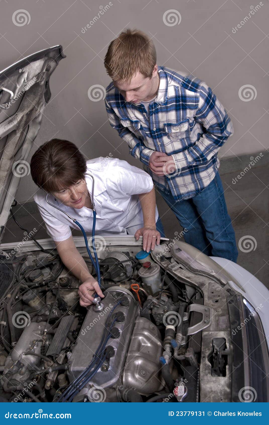 Nurse Gives Car Engine a Check Up Stock Image - Image of nurse, hood ...
